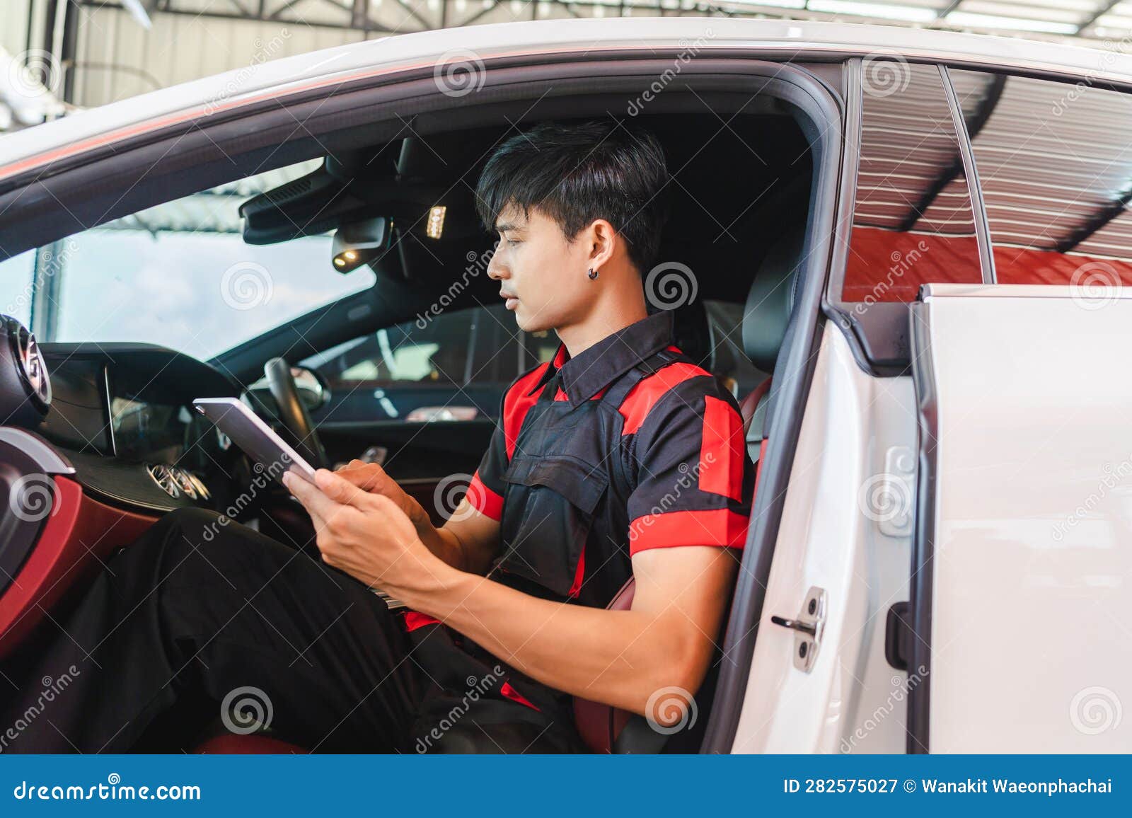 Auto Mechanic Performs Car Diagnostics Wirelessly. Scan for Errors and ...
