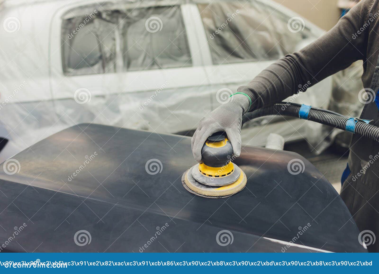 Auto Mechanic Preparing the Car for Paint Job by Applying Polish with ...