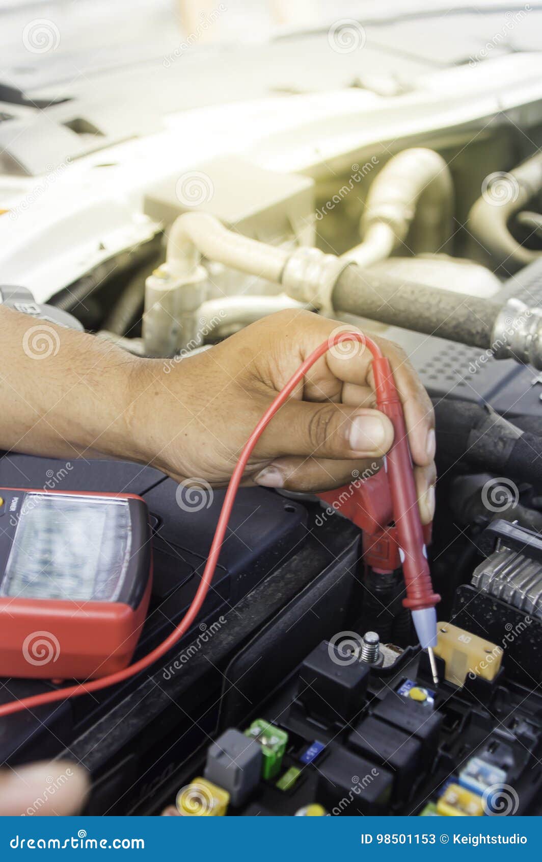 Auto Mechanic Uses a Multimeter Voltmeter. Stock Image - Image of ...