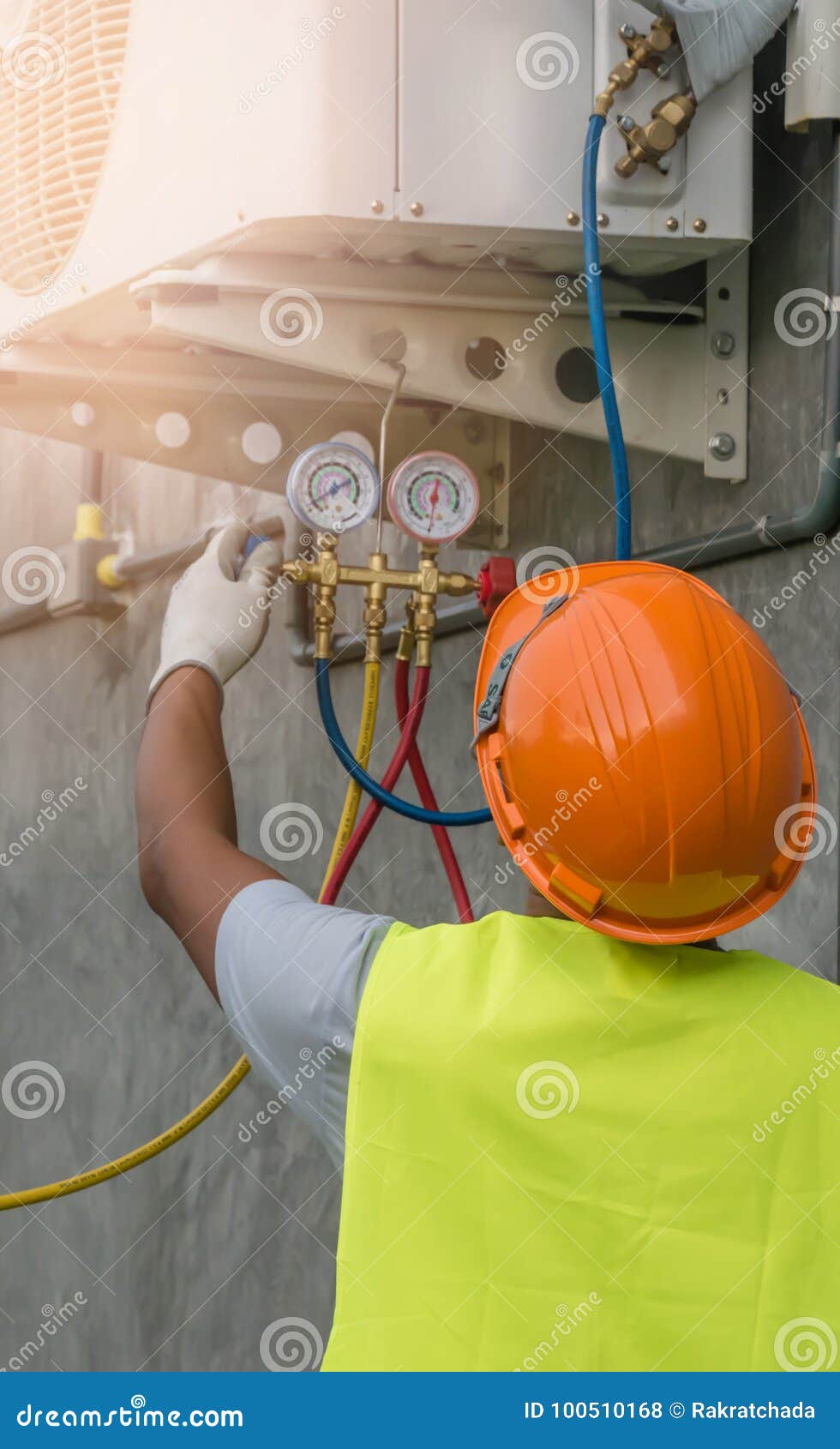Mechanic Uses a Pressure Gauge on the Air Compressor Stock Photo ... Mechanic Uses a Pressure Gauge on the Air Compressor Stock Photo ...