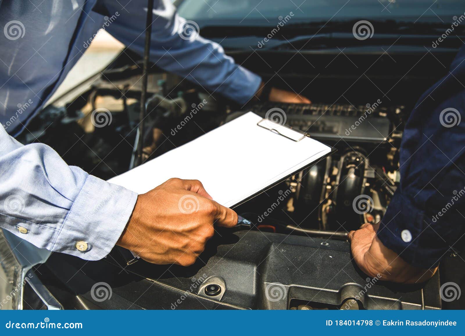Auto Mechanic Using Checklist for Car Engine Systems after Fixed. Stock ...