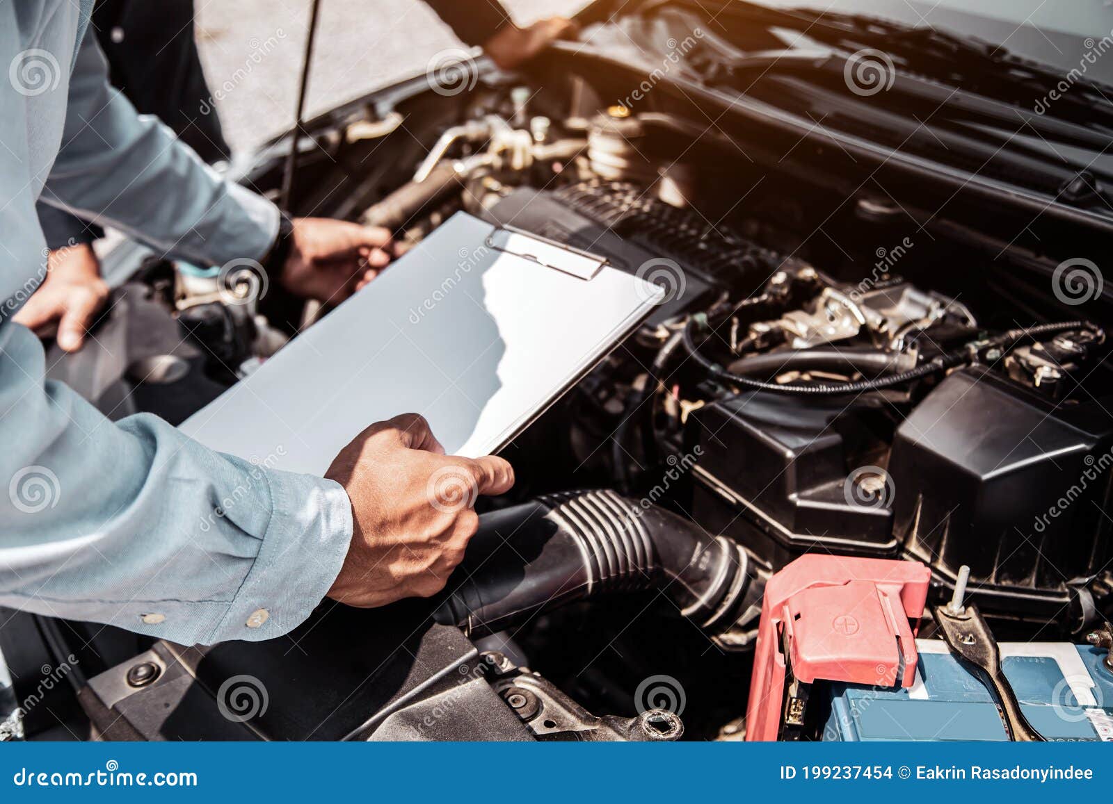 Auto Mechanic Using Checklist for Car Engine Systems after Fixed. Stock ...
