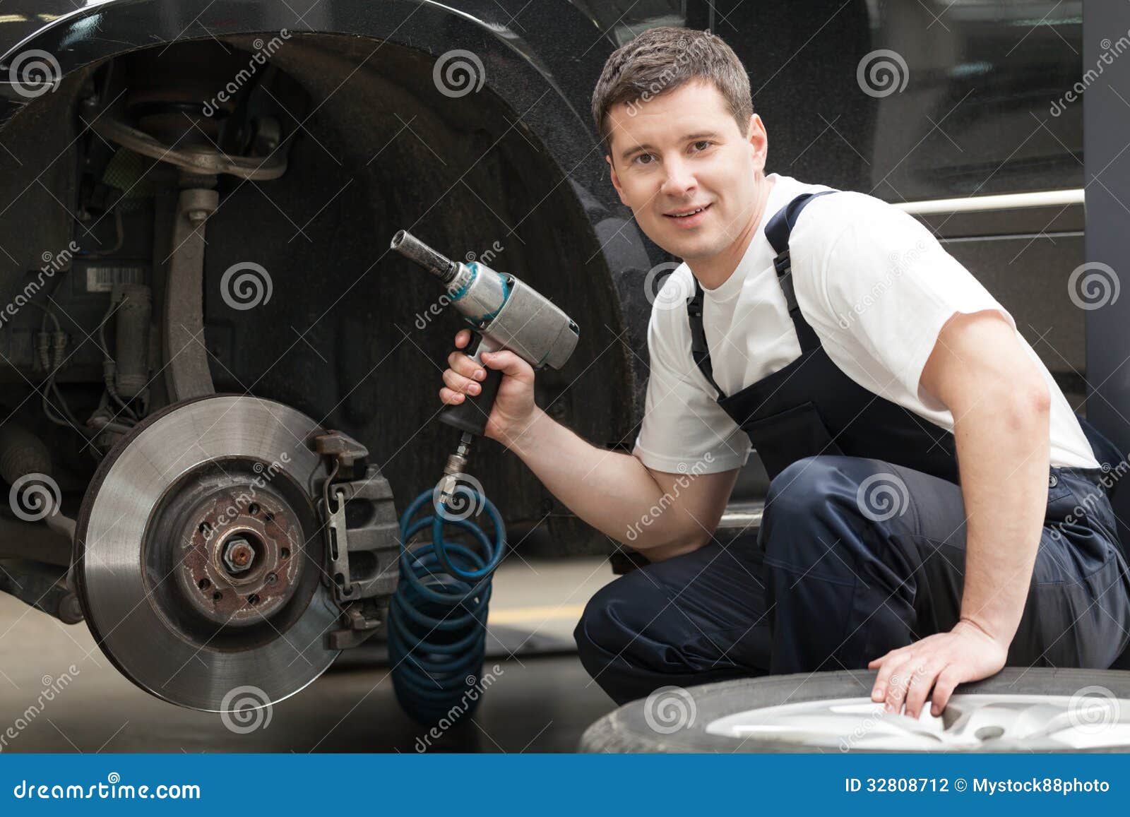 Auto mechanic at work. stock photo. Image of cheerful - 32808712