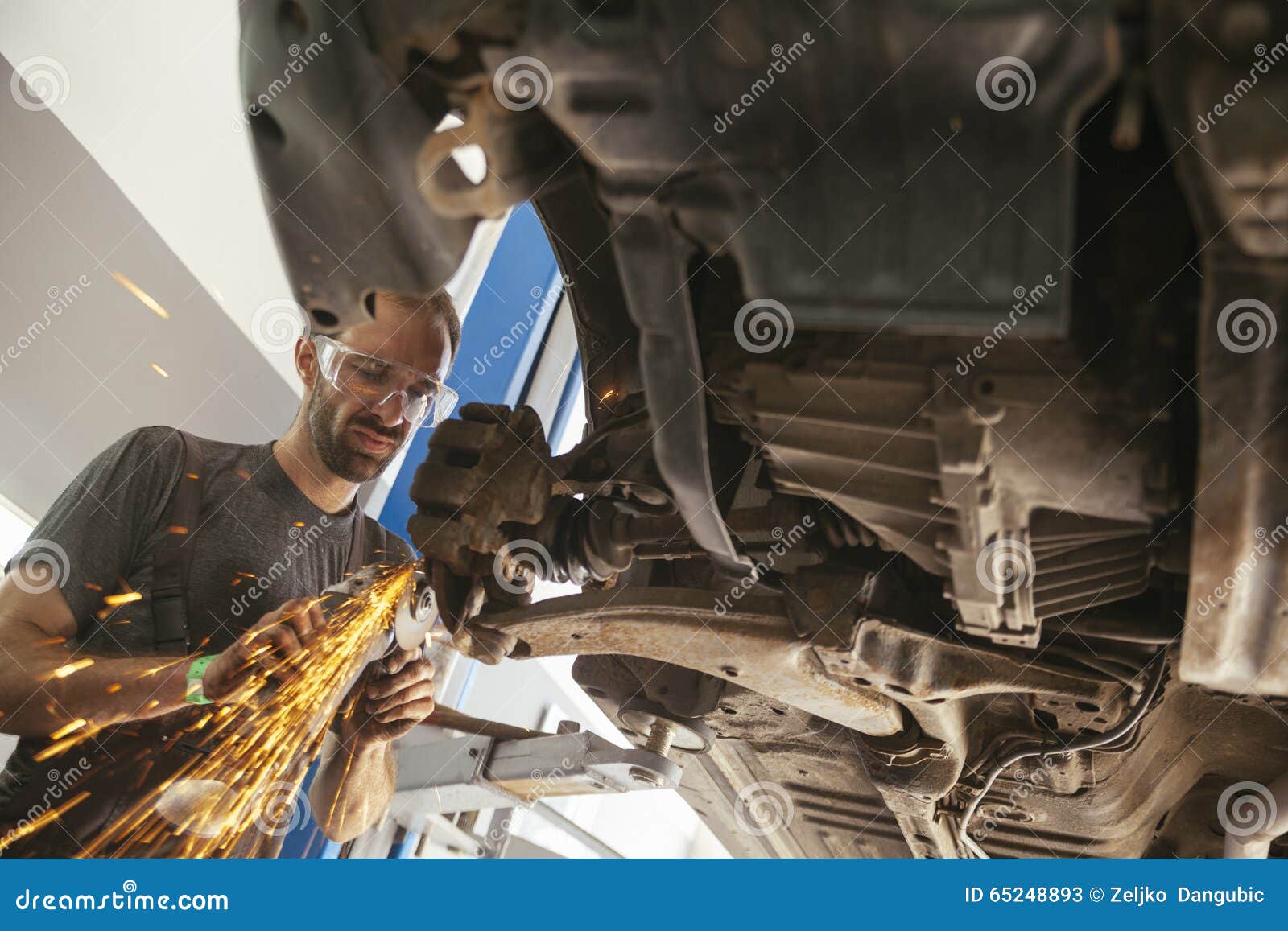 Auto Mechanic at Work stock image. Image of maintenance - 65248893
