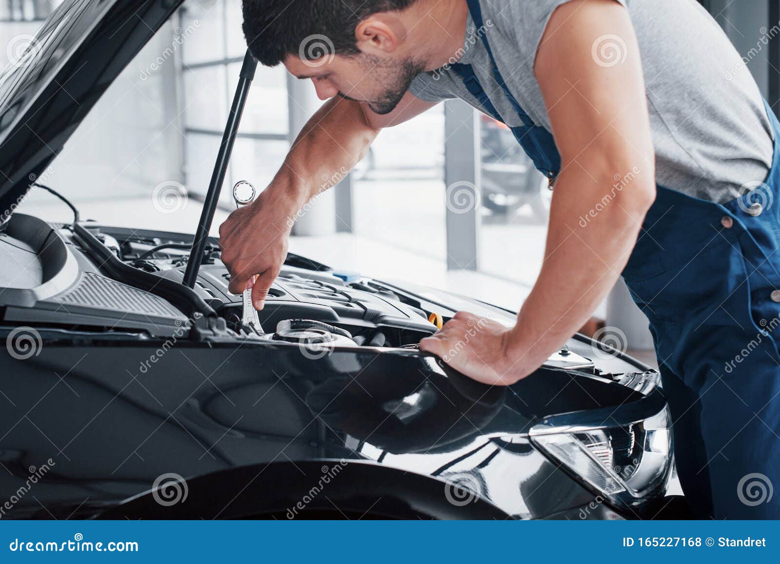Auto Mechanic Working in Garage. Repair Service. Stock Photo - Image of ...
