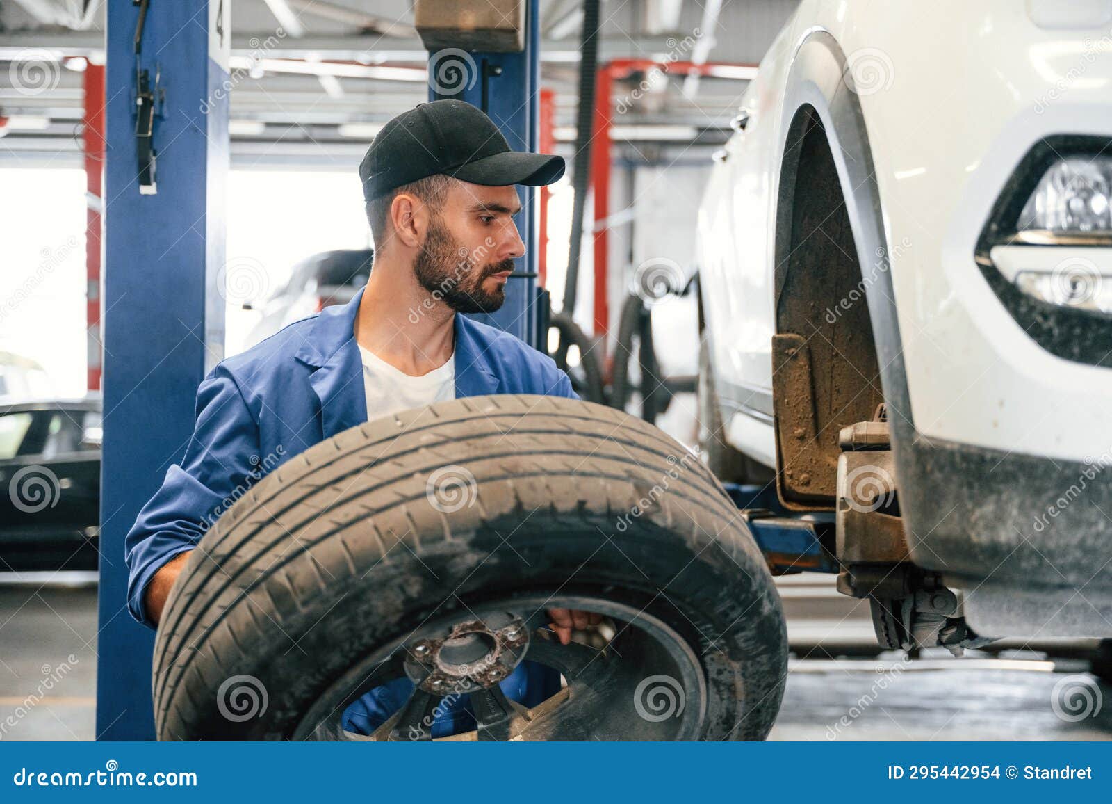 Auto Mechanic Working in Garage. Repair Service Stock Photo - Image of ...