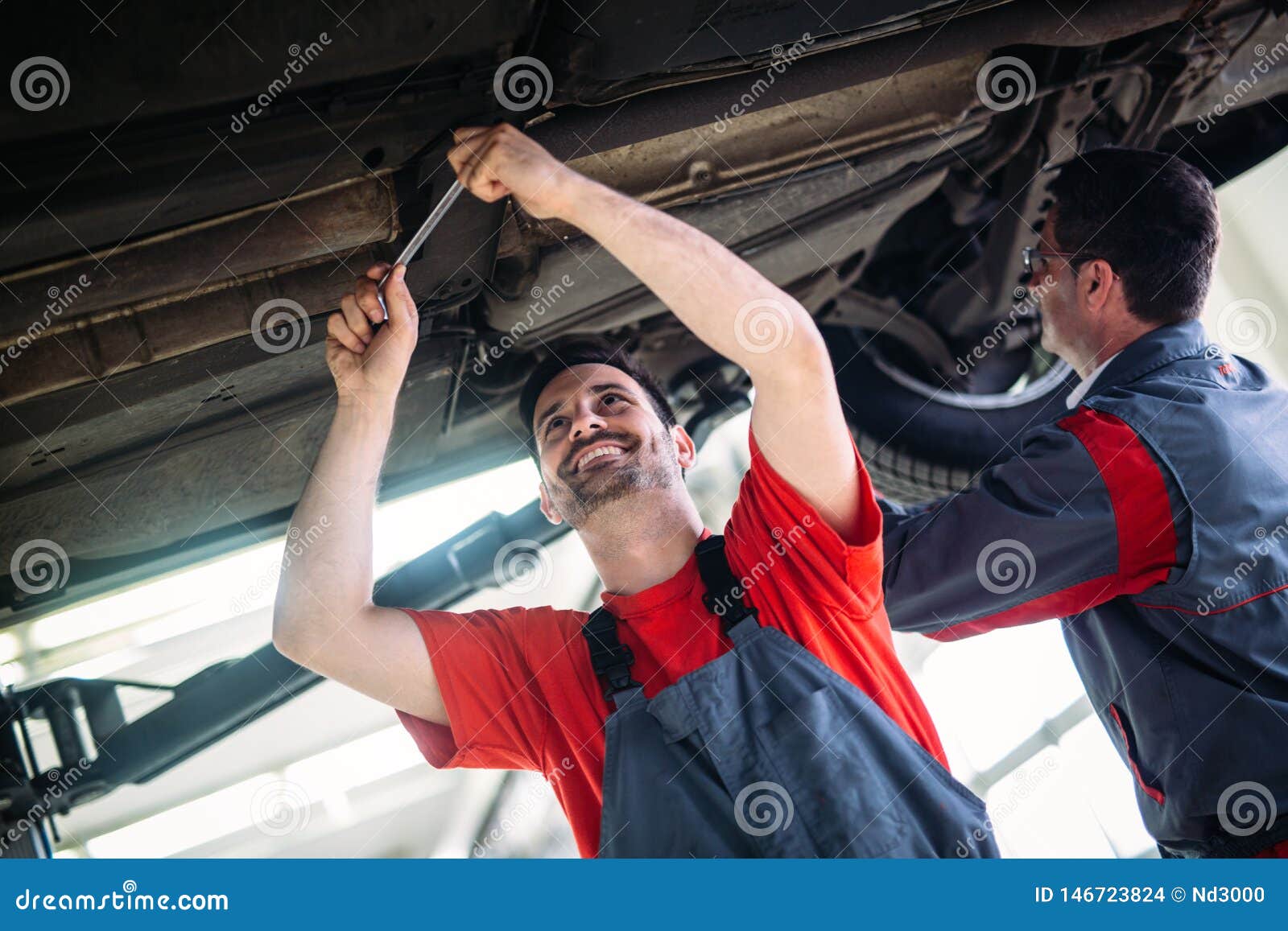 Auto Mechanic Working in Garage. Repair Service Stock Photo - Image of ...