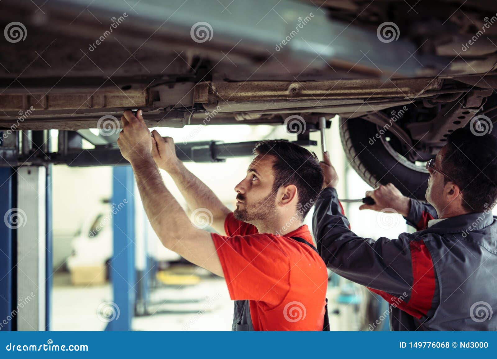 Auto Mechanic Working in Garage. Repair Service Stock Photo - Image of ...