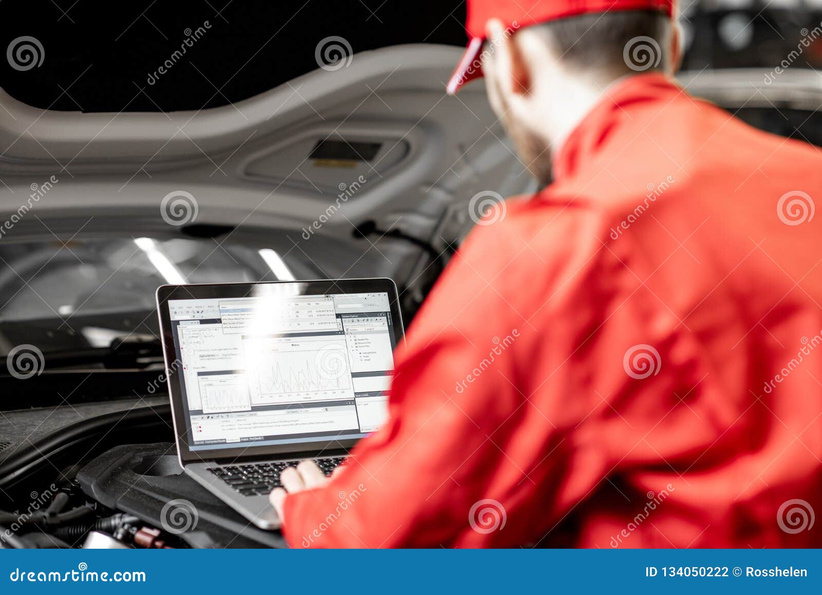 Auto Mechanics Doing Diagnostics with Laptop Stock Photo - Image of ...