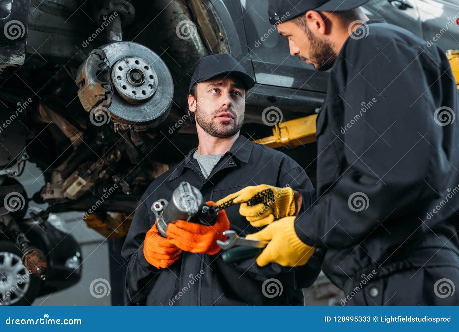 Auto Mechanics Working with Car and Tools Stock Image - Image of ...