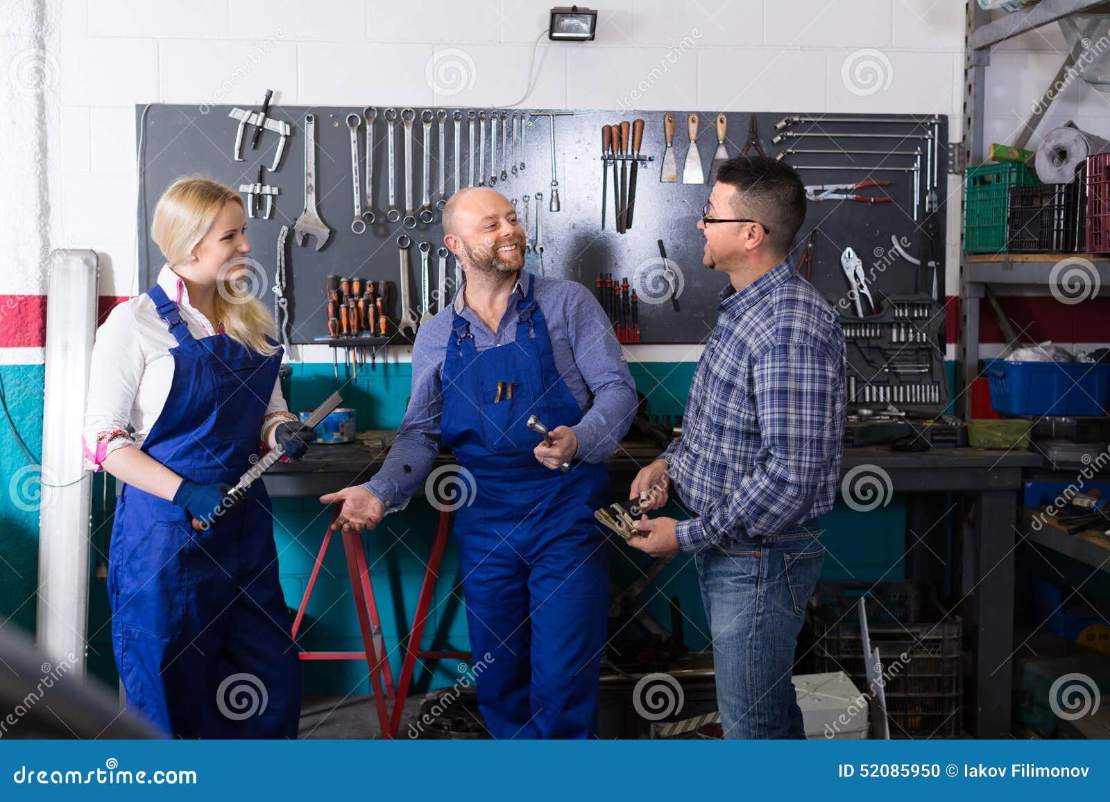 Auto mechanics at workshop stock photo. Image of happy - 52085950