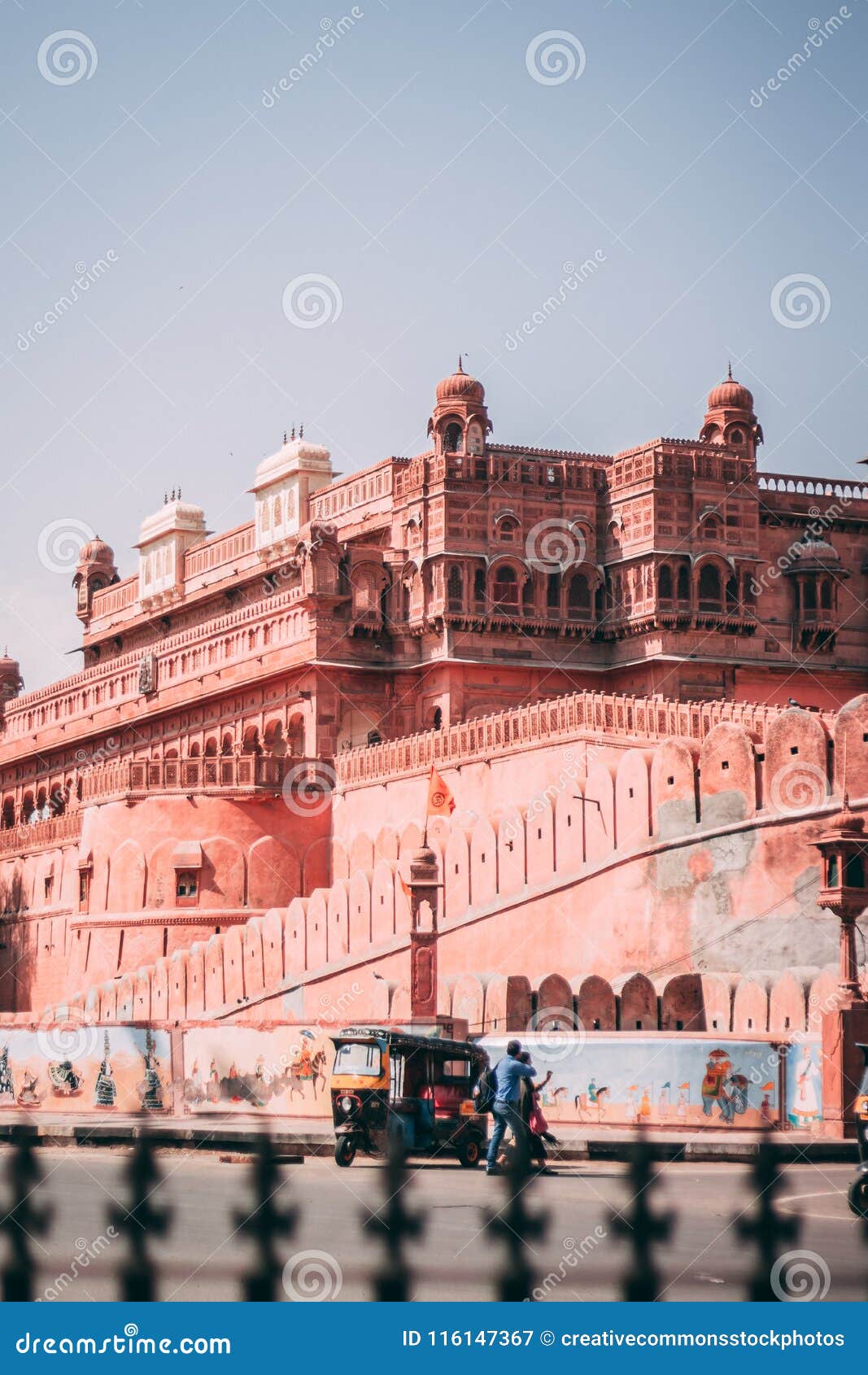 Auto Rickshaw Parked Beside Brown Structure Picture. Image: 116147367