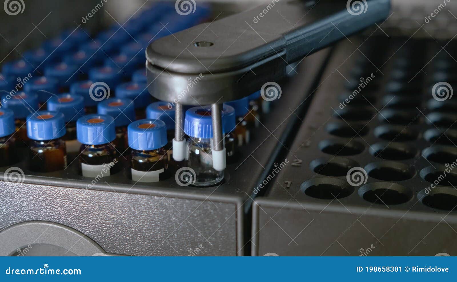 Auto Sampler Takes a Vial and Injects a Sample into High Performance ...