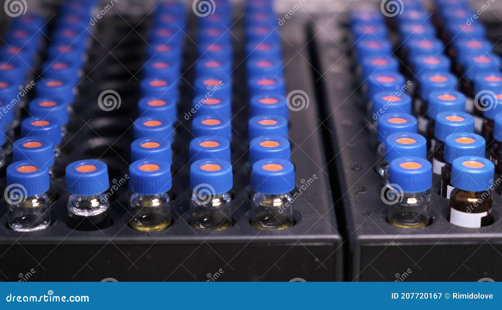 Automated Conveyor Line of Auto Sampler in HPLC System. Vials with Blue ...