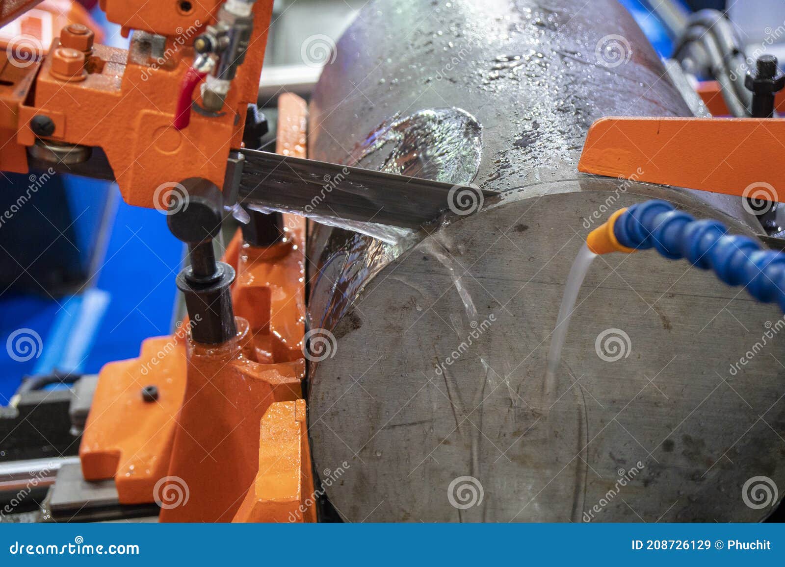 The Automatic Band Saw Machine Cutting the Metal Bar with Coolant ...