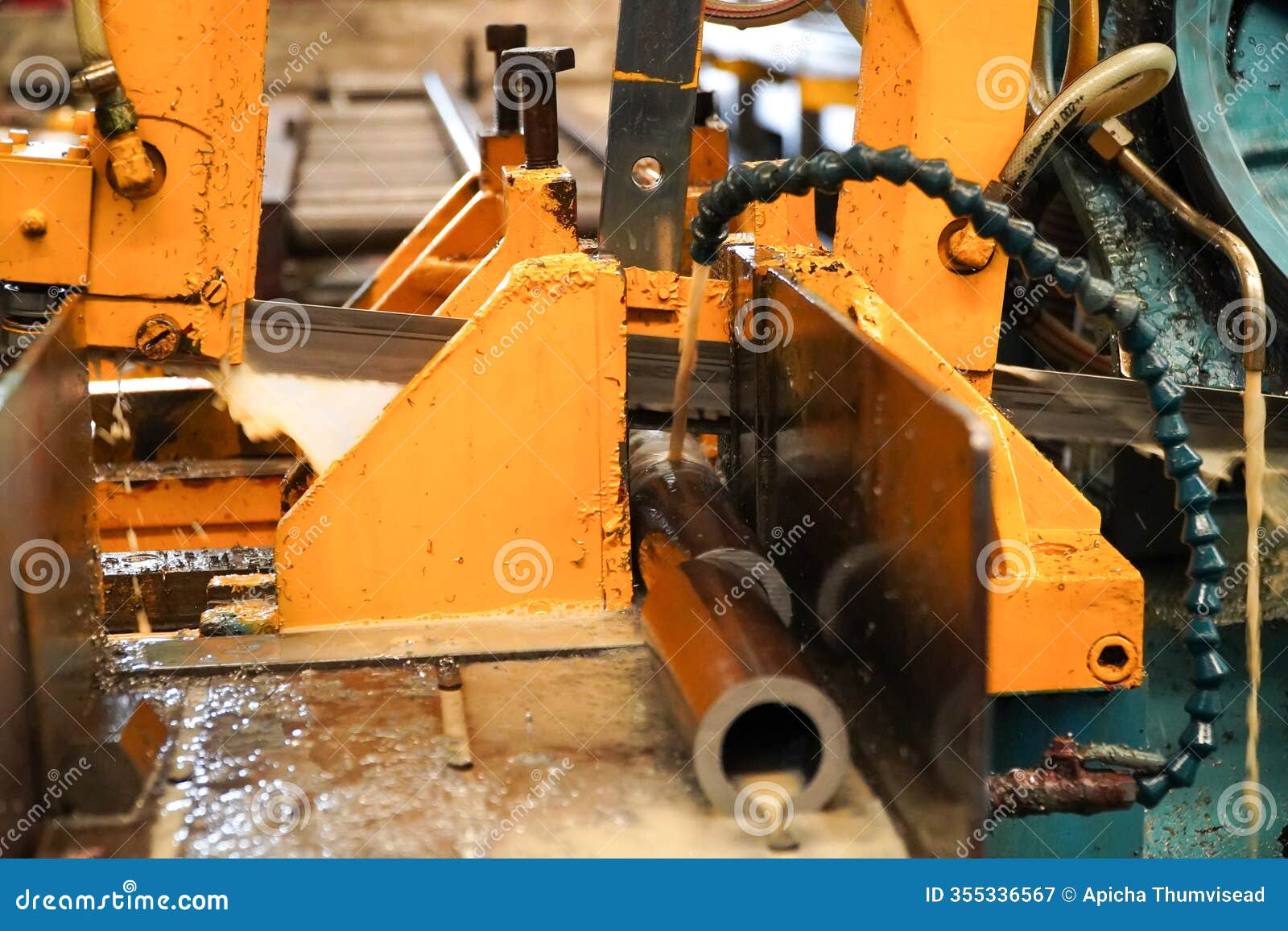 Automatic Band Saw Machine Cutting the Metal Rod with Water Base ...