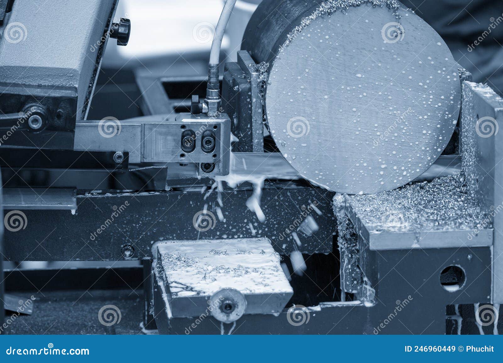 The Automatic Band Saw Machine Cutting the Metal Rod with Water Base ...