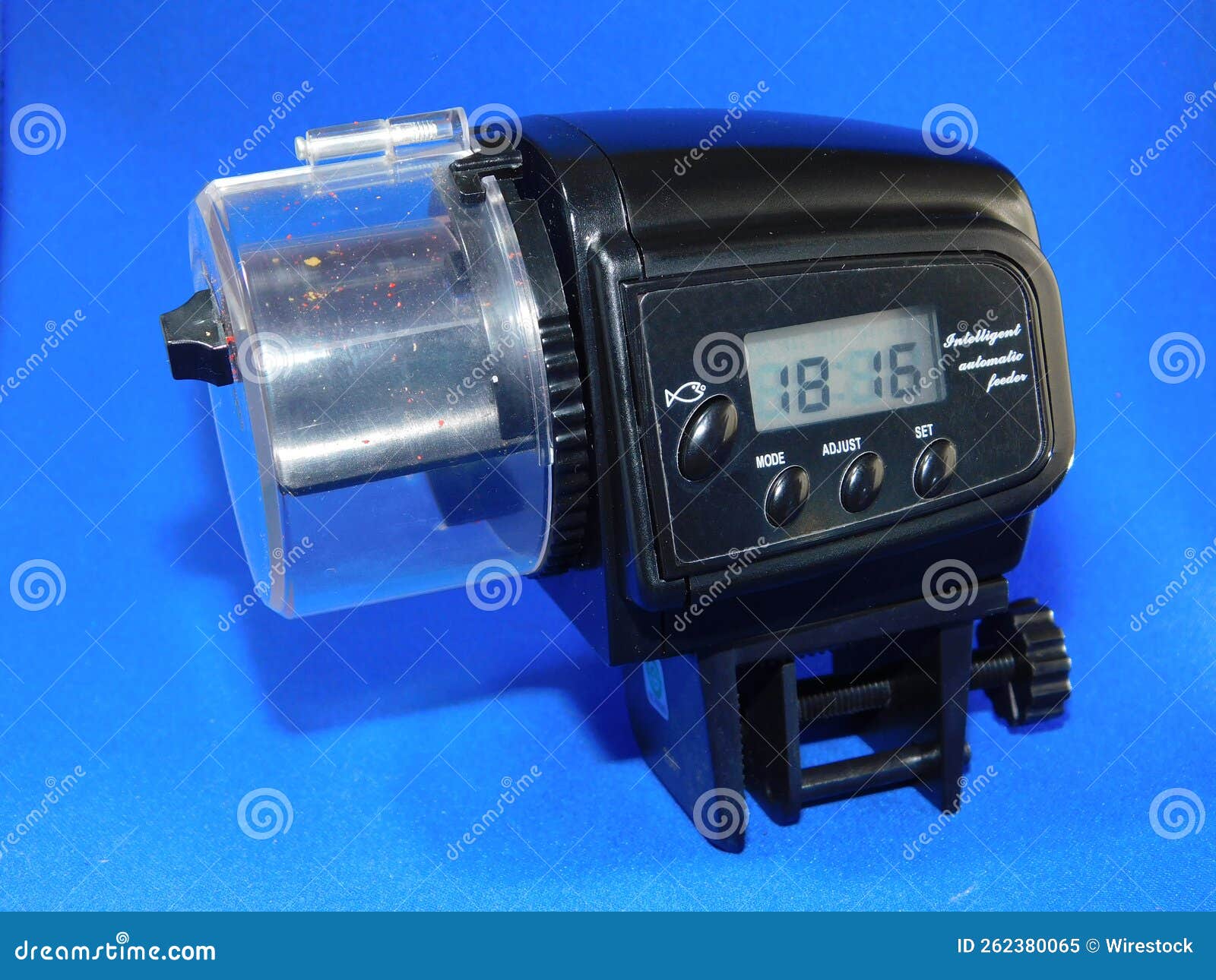 Automatic Fish Feeder Isolated in the Blue Background Stock Image ...