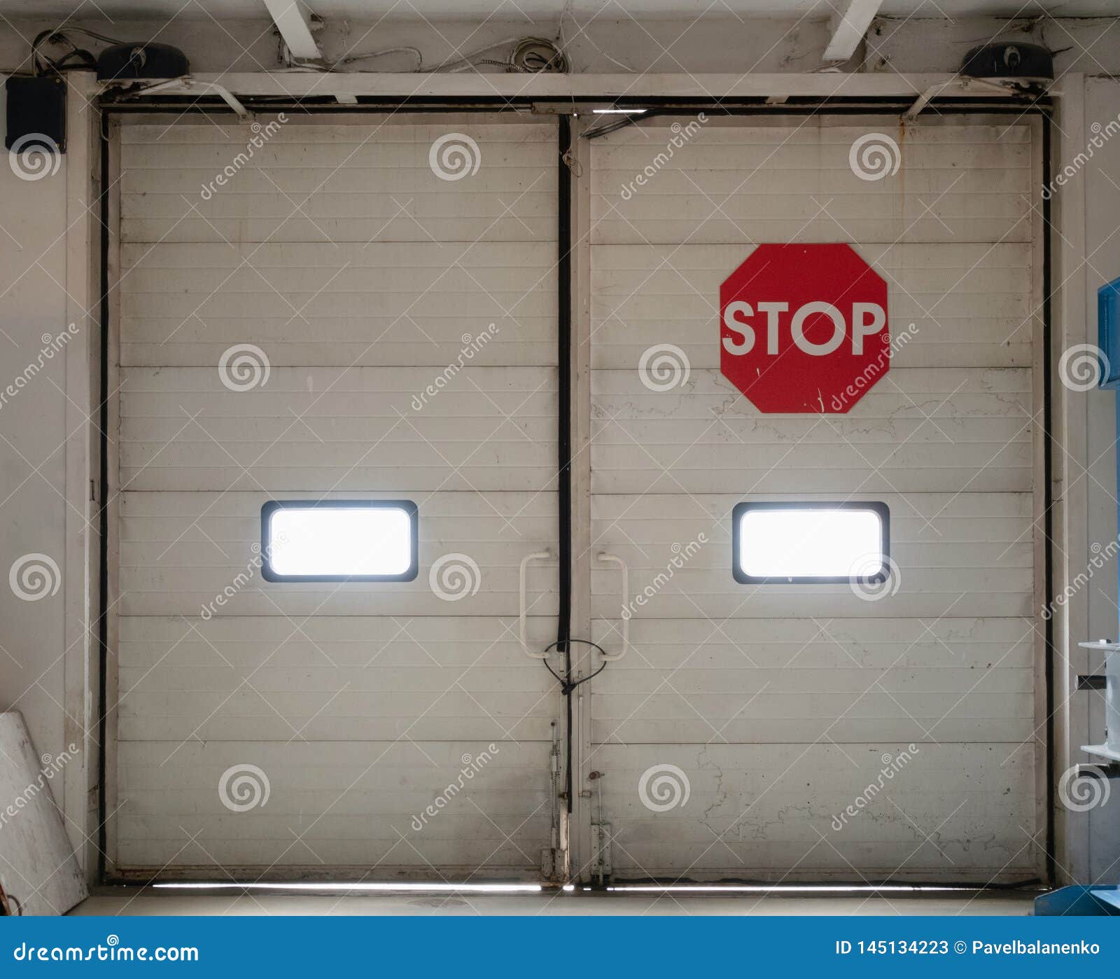 Automatic Gates Inside Industrial Storage Warehouse with Red Stop Sign ...