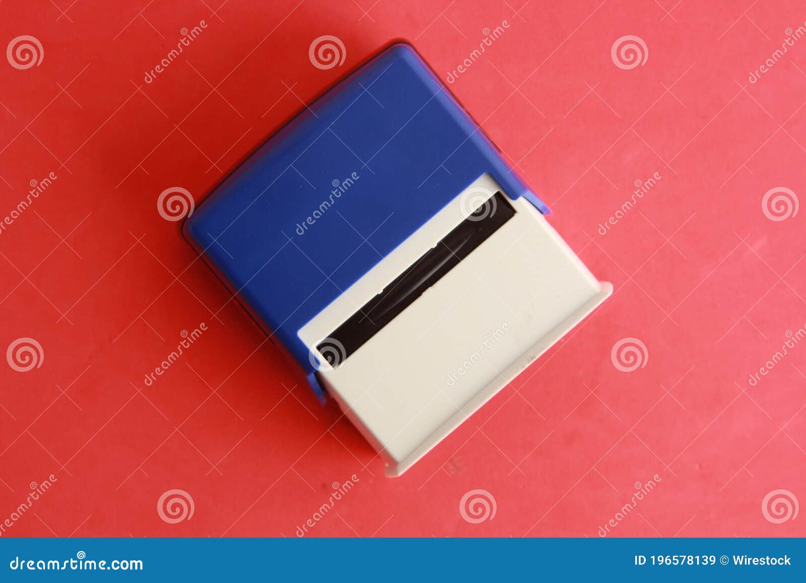 Automatic Ink Stamp on a Red Surface Stock Image - Image of text ...