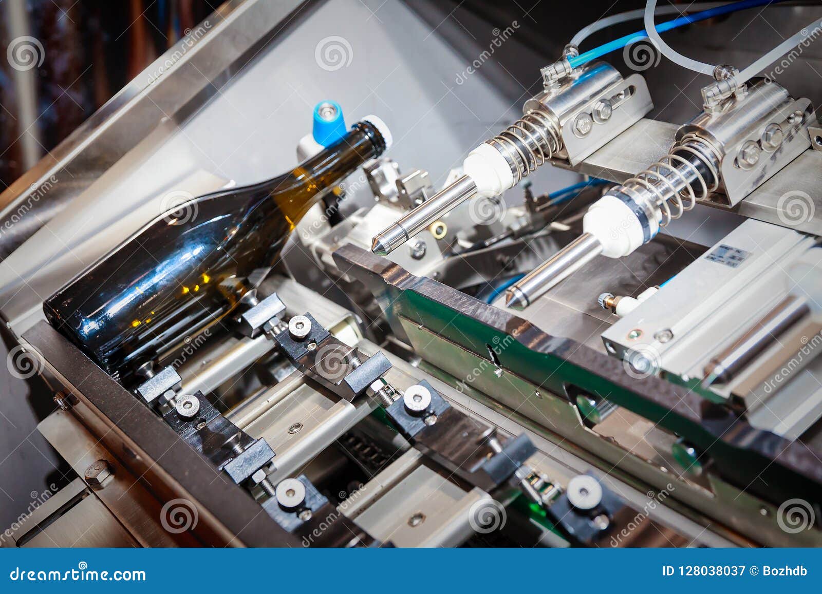 The Automatic Transfer Line of Pouring of Wine in Bottles Stock Image ...