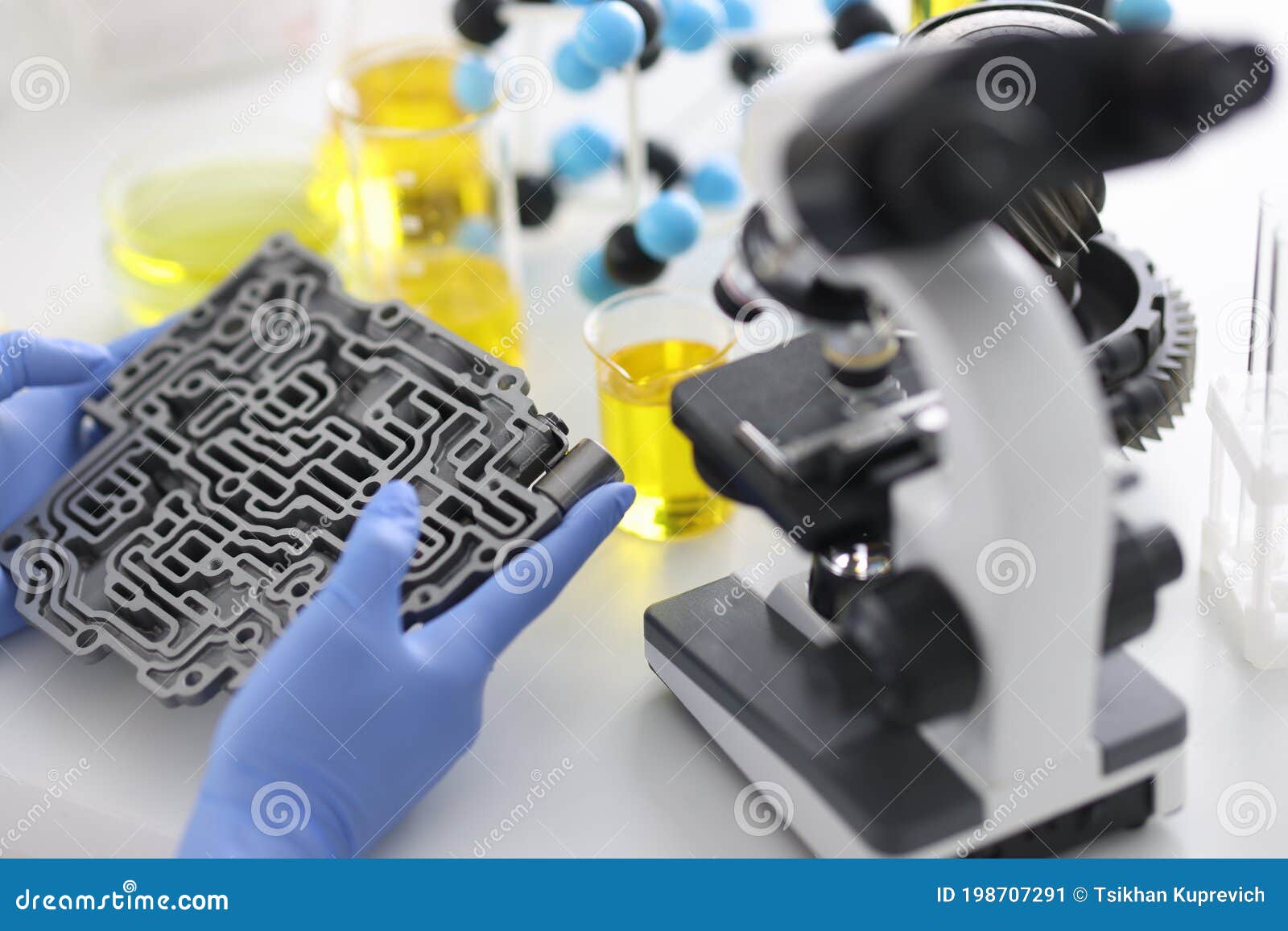 Automatic Transmission Lies in Rubber Gloves on Table with Microscope ...
