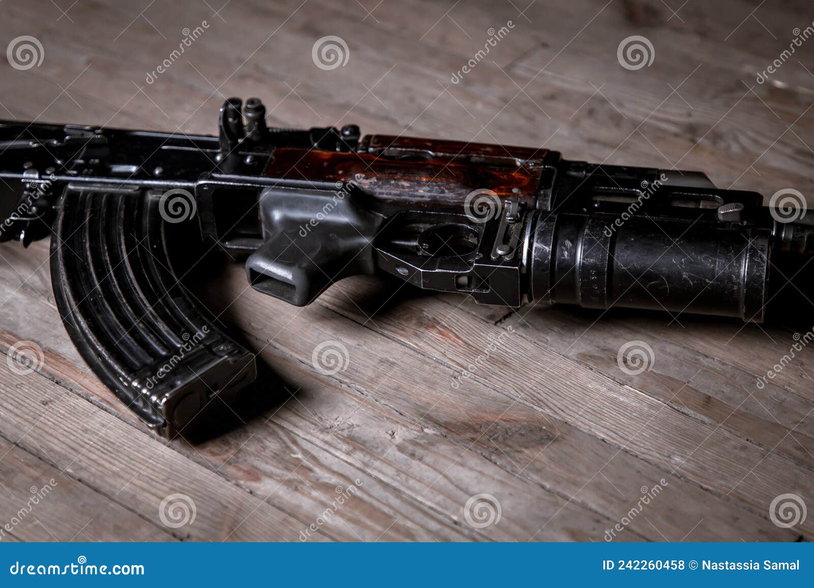 Automatic Weapons Kalashnikov Assault Rifle on Wooden Background. Close ...