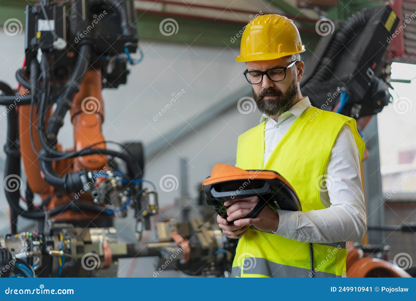 Automation Engineer Holding Scanner in Industrial in Factory. Stock ...