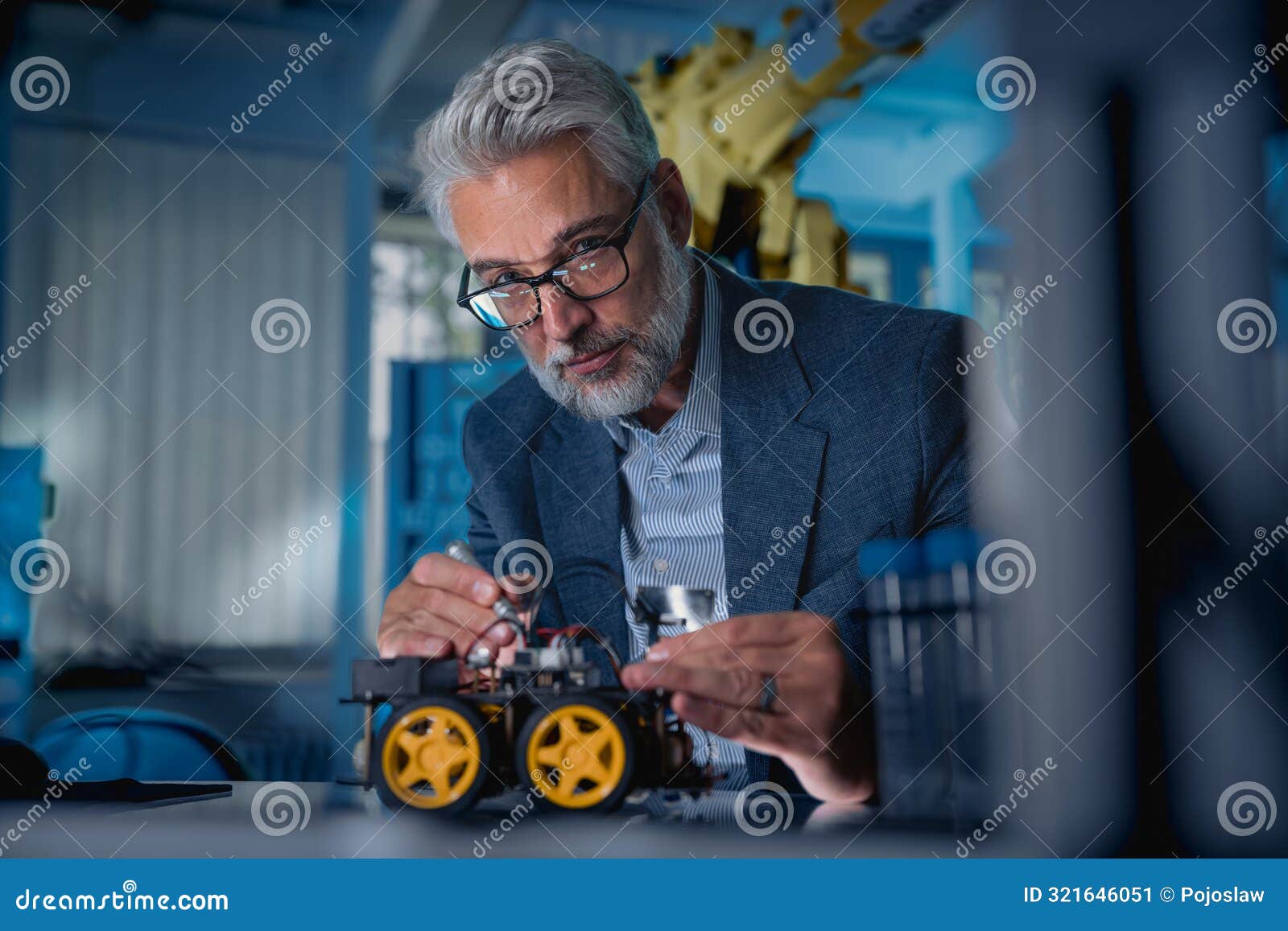 Automation, Robotics Engineer Assembling Robotic Car Prototype for ...