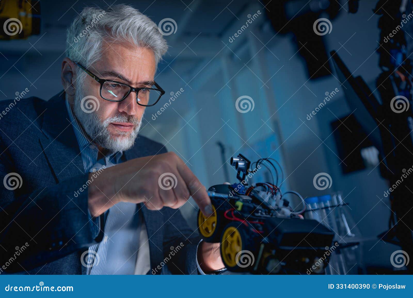 Automation, Robotics Engineer Assembling Robotic Car Prototype for ...