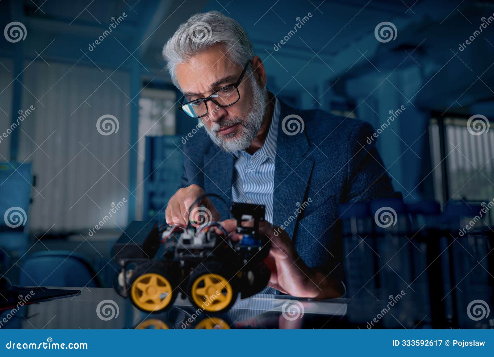 Automation, Robotics Engineer Assembling Robotic Car Prototype for ...