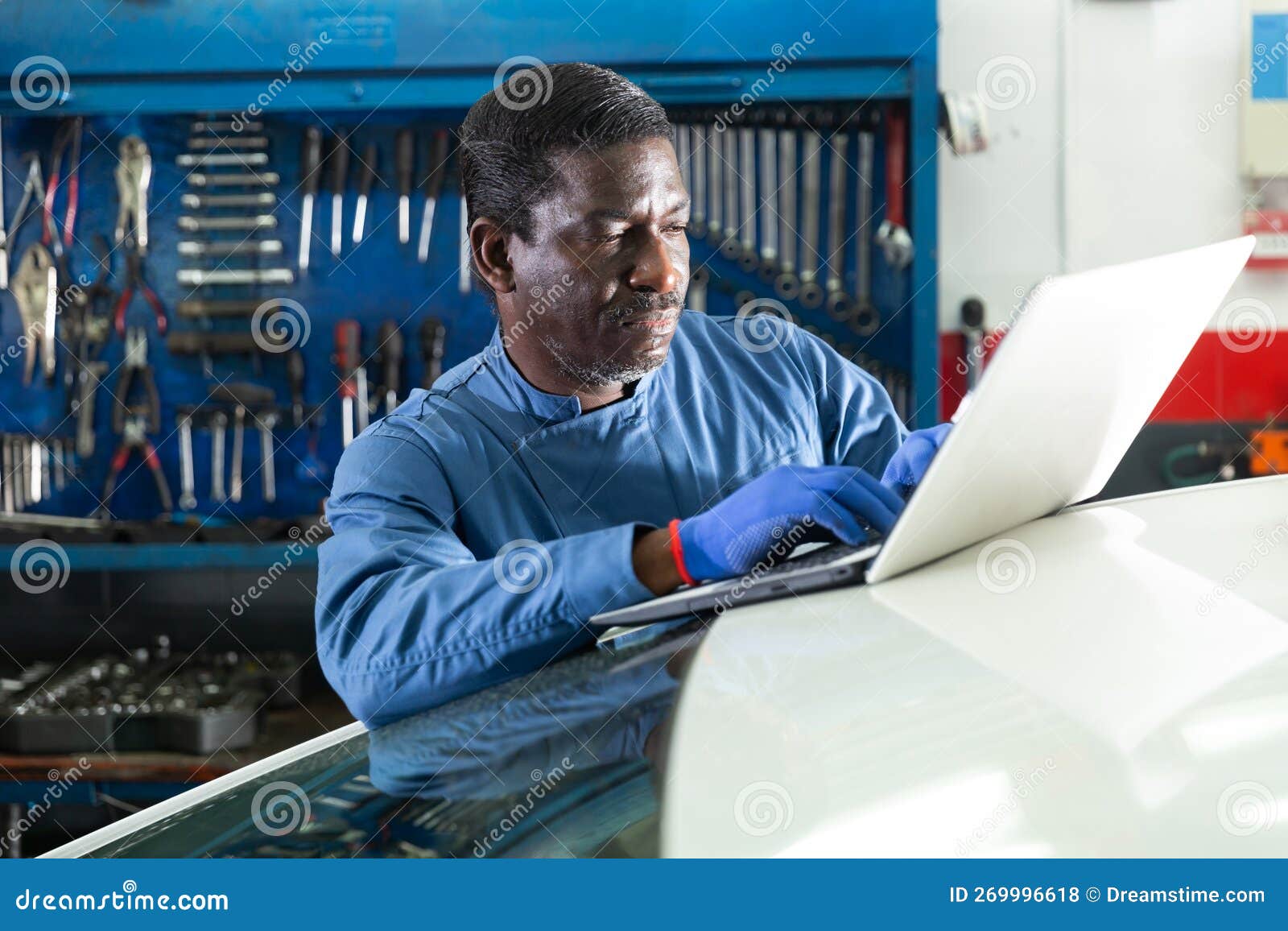 Automobile Diagnosis. Car Mechanic Repairer Looks for Engine Failure ...