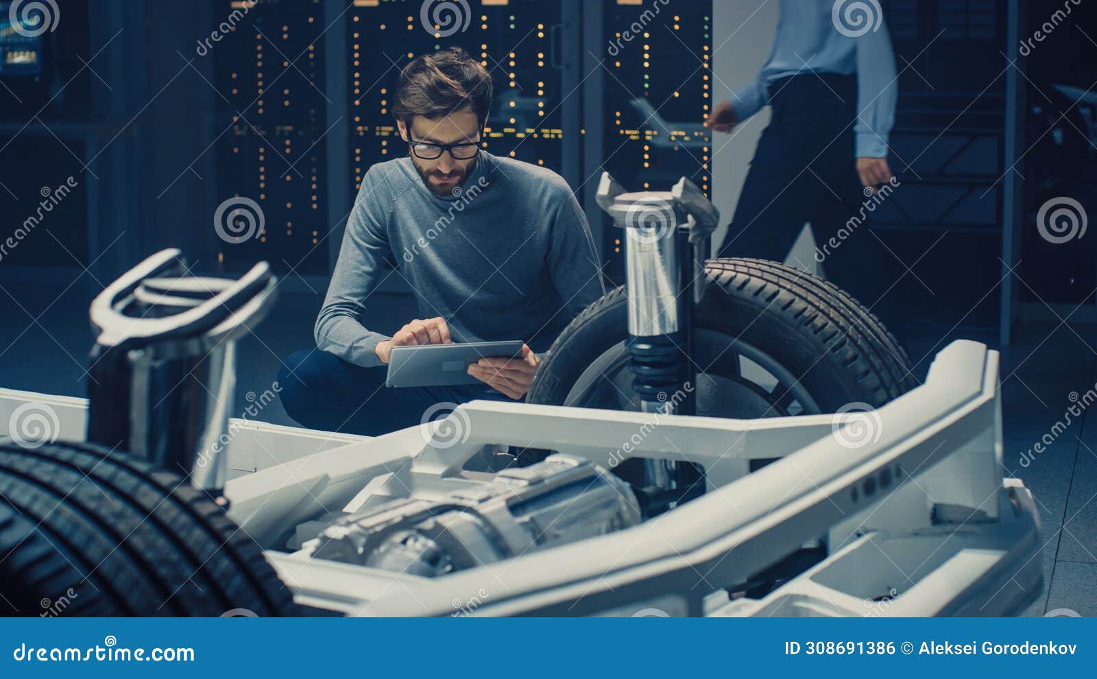 Automobile Design Engineer Sitting beside Hybrid Electric Car Chassis ...