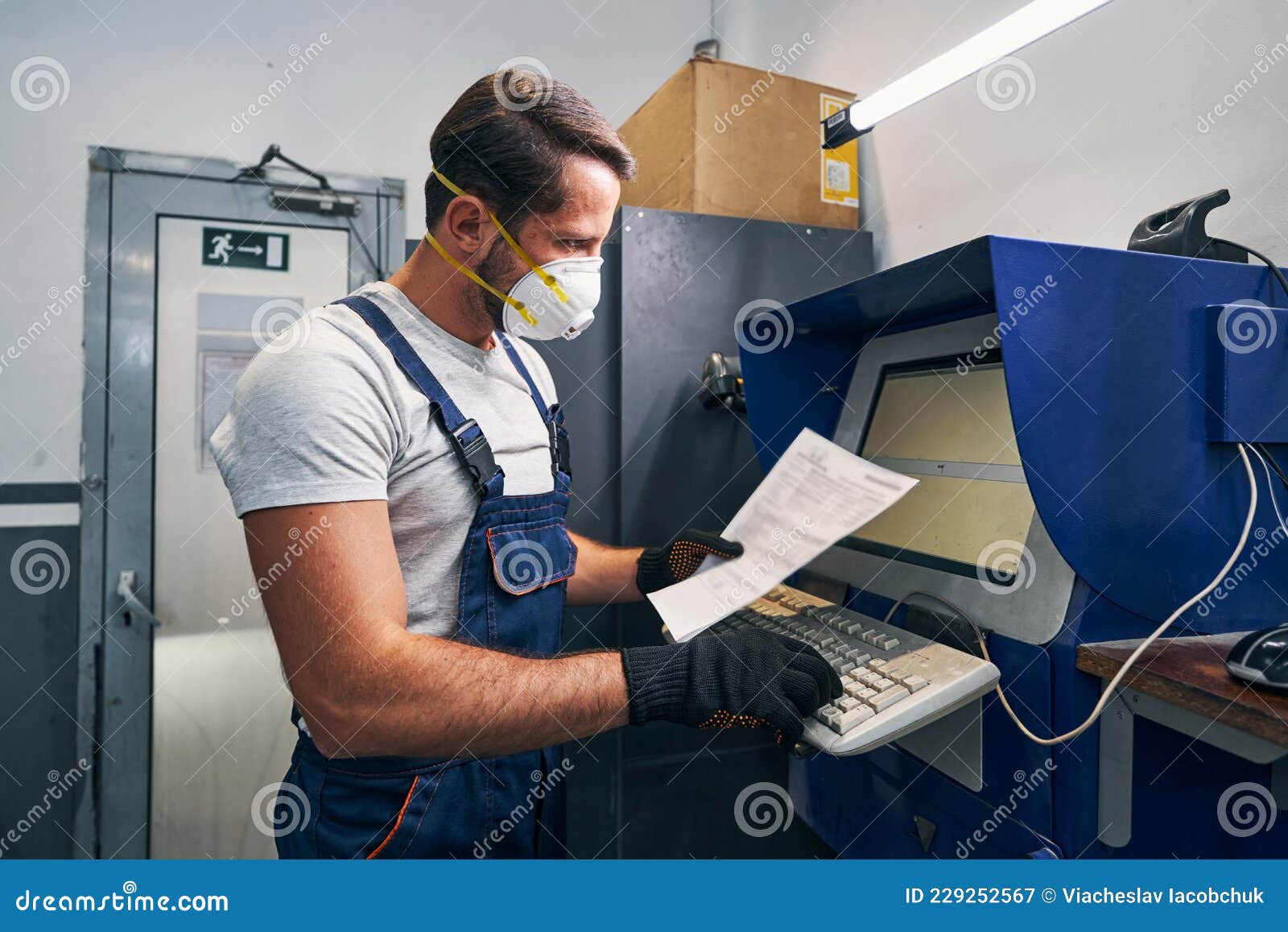 Automobile Mechanic is Entering Information into Computer Stock Image ...