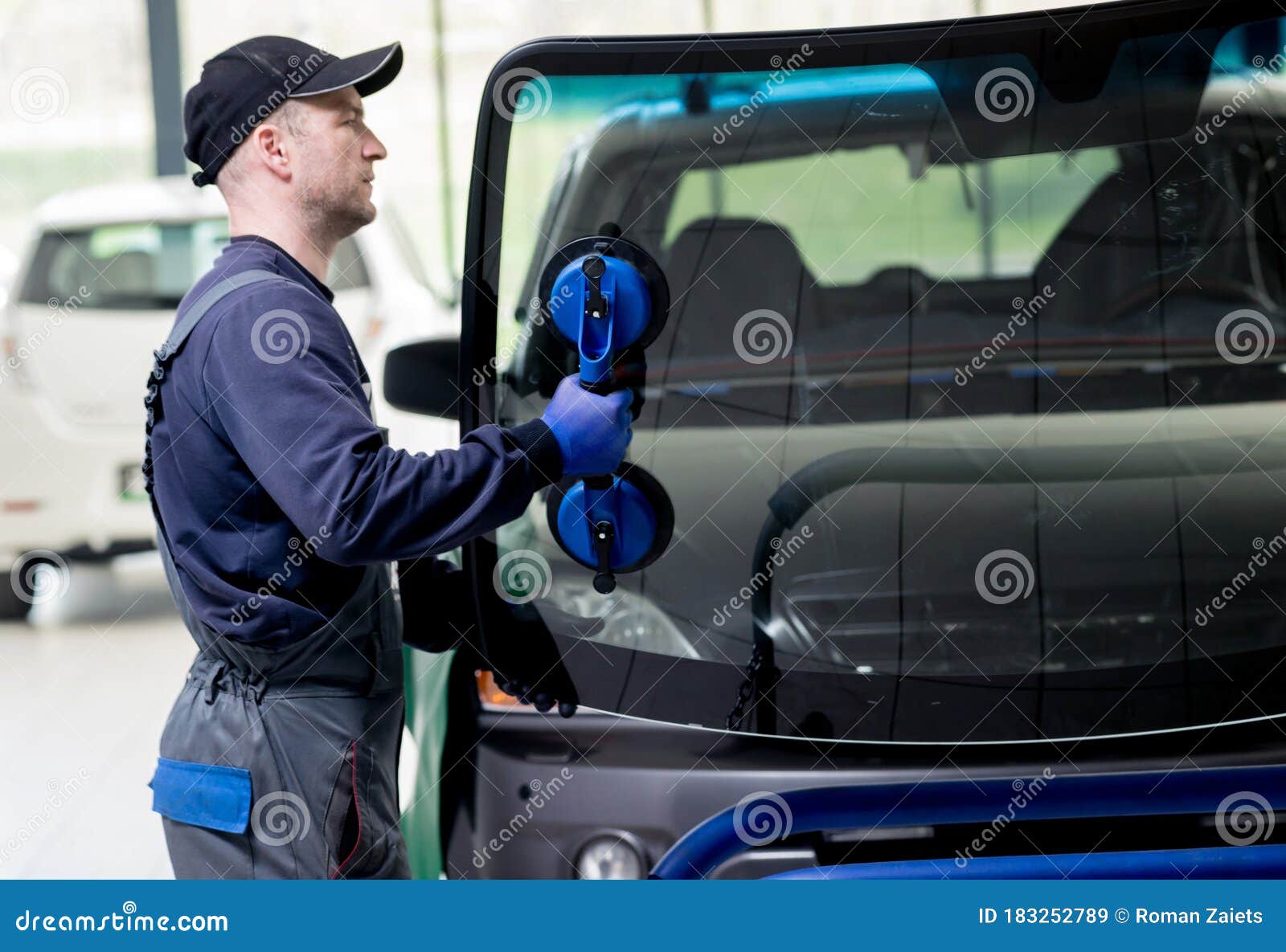 Automobile Special Workers Replacing Windscreen of a Car in Auto ...
