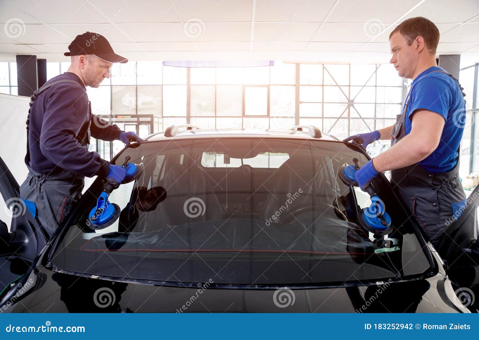 Automobile Special Workers Replacing Windscreen of a Car in Auto ...