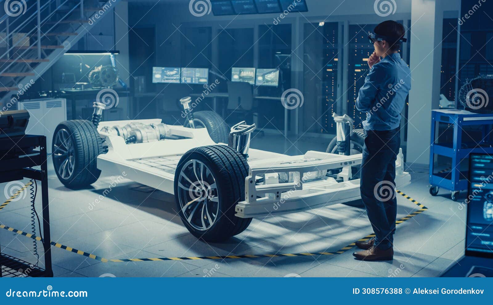 Automotive Engineer Working on Electric Car Chassis Platform, Using ...