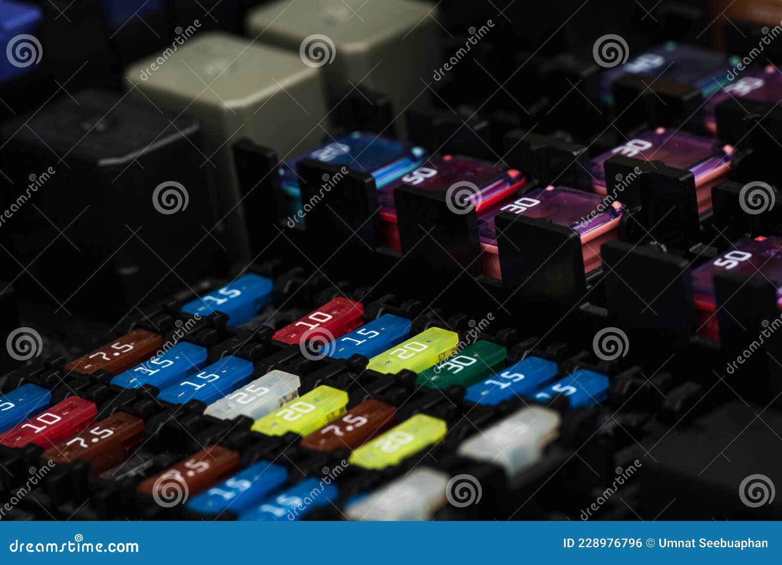 Automotive Fuses On A Black Panel With Holders And Multi-colored ...