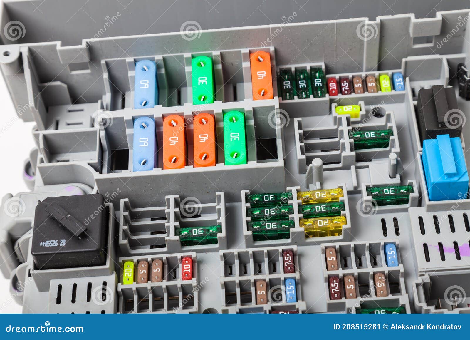 Automotive Fuses on a White Panel with Holders and Multi-colored ...