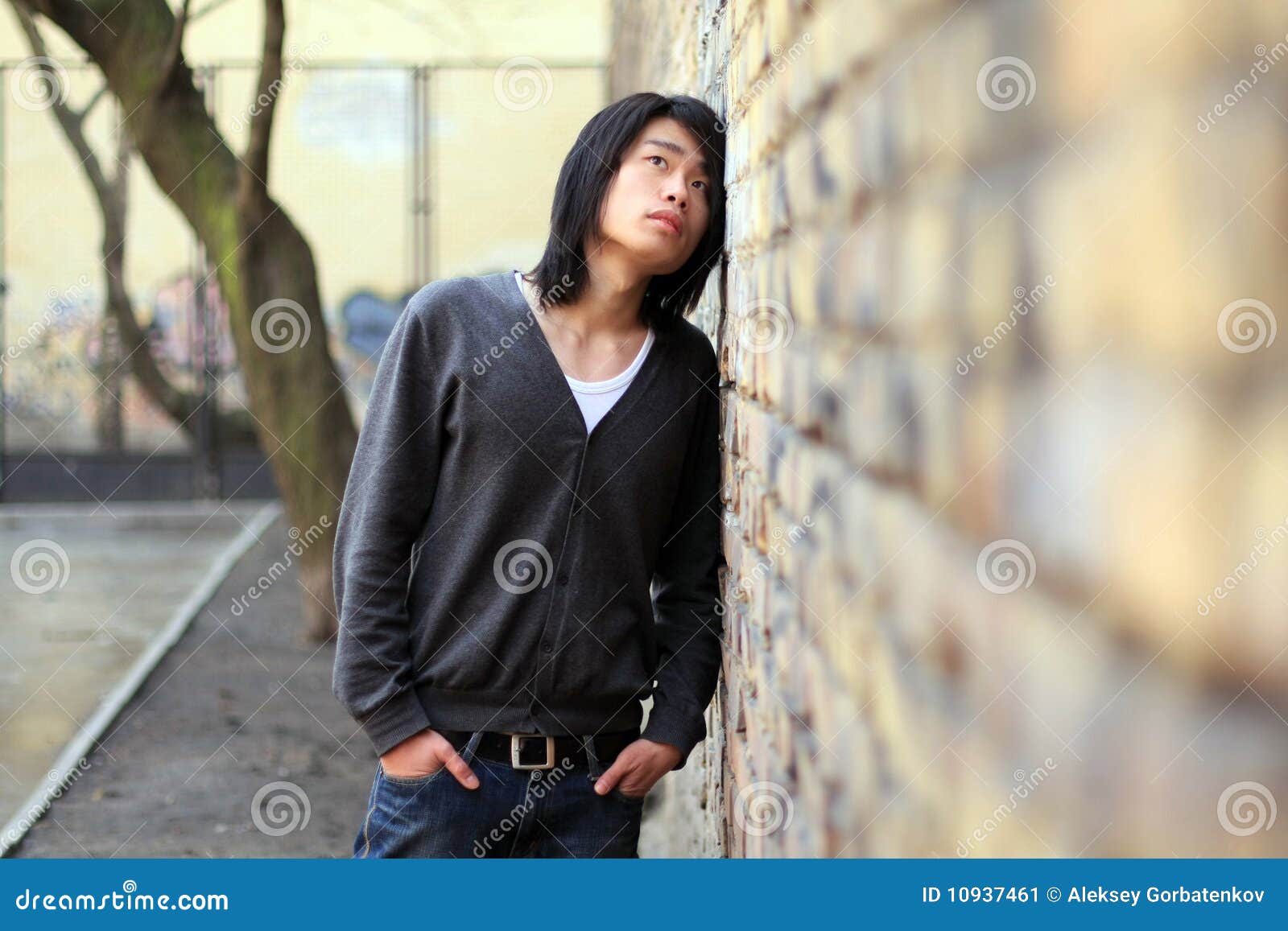 Autumn Asian Man Looking Up Lean on the Wall Stock Image - Image of ...