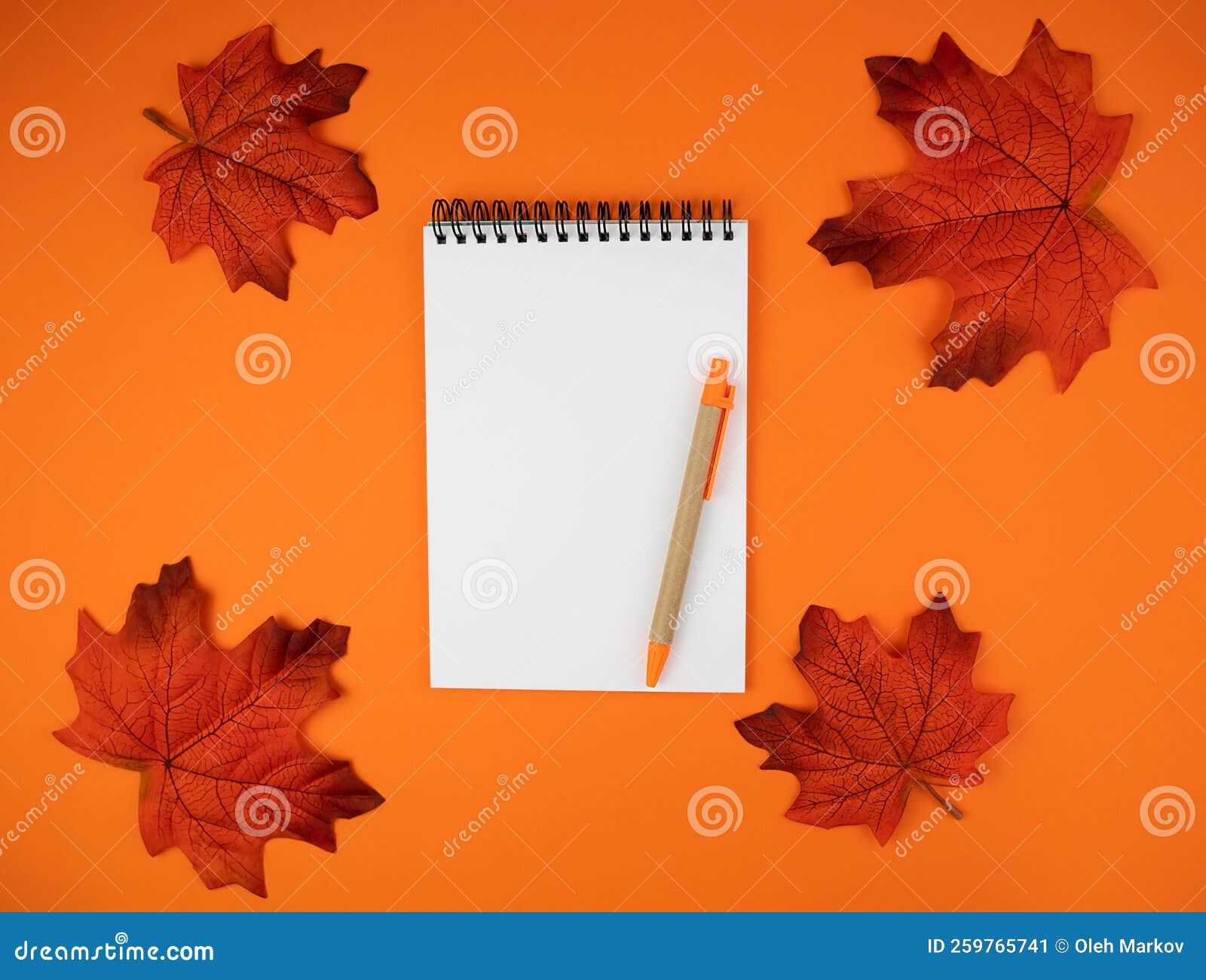 Autumn Composition with Blank Notepad, Pen and Autumn Leaves on Orange ...