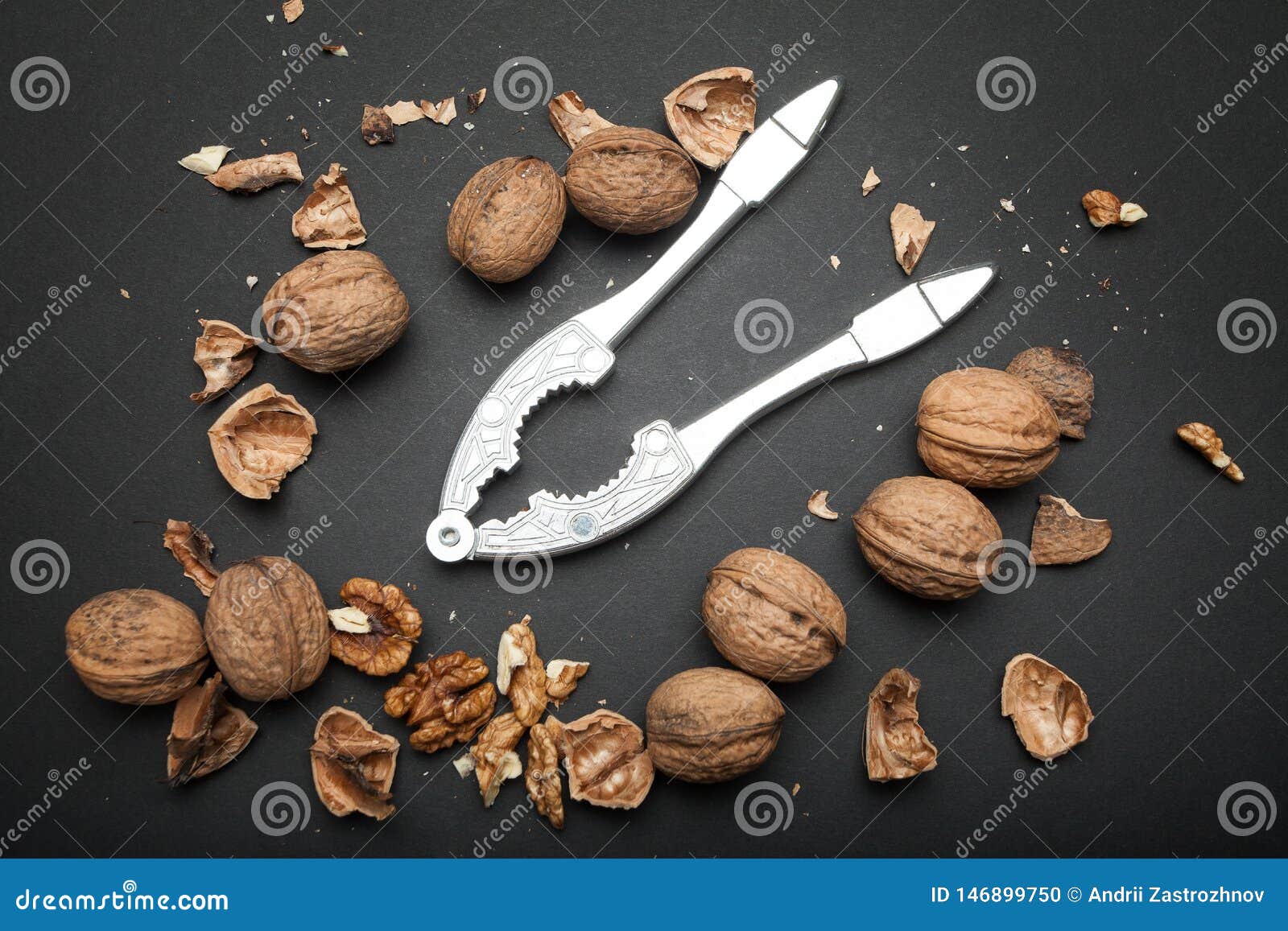 Autumn Harvest of Walnuts on a Black Background. Nutcracker and Kernels ...