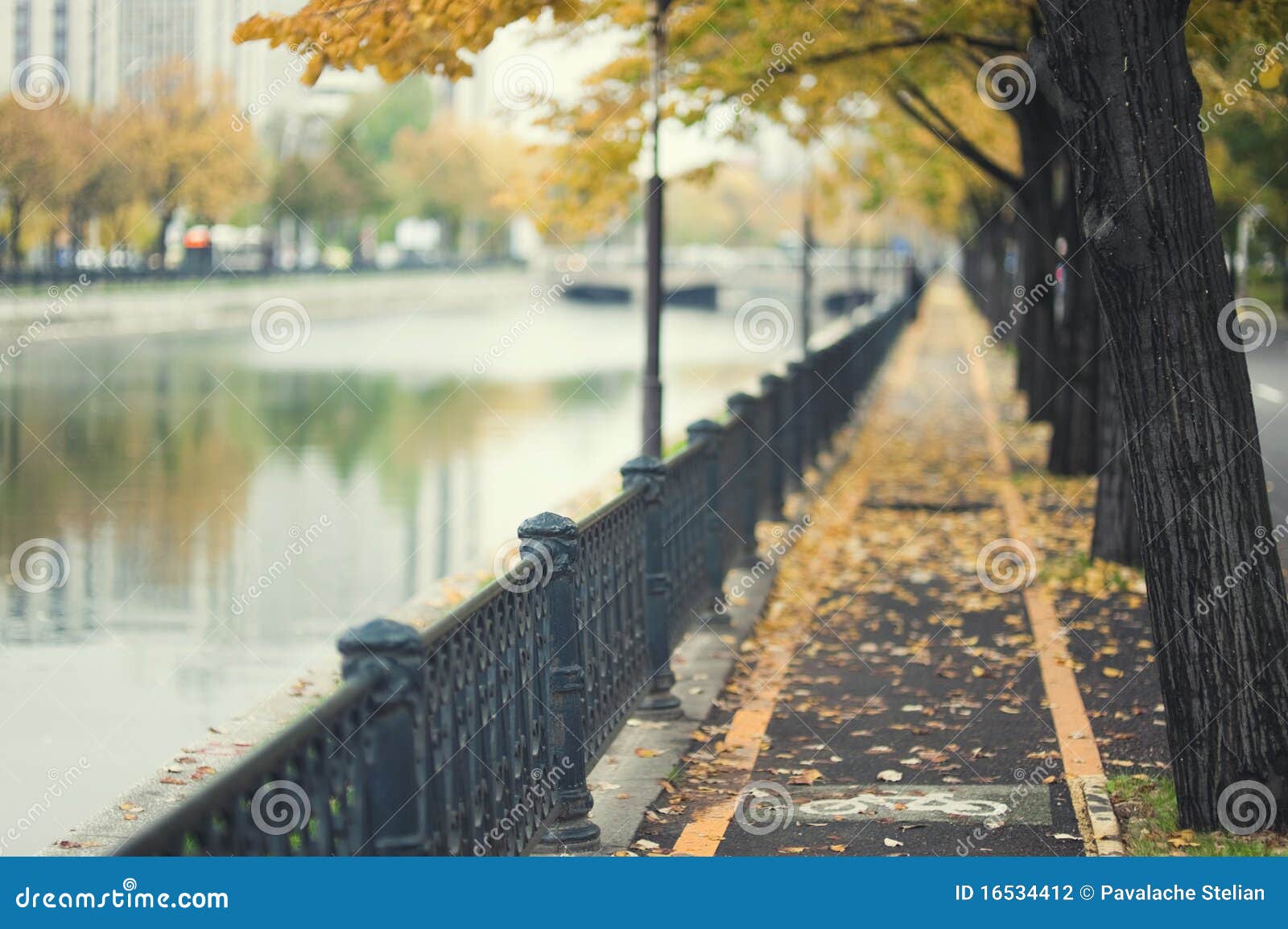 Autumn path by urban river stock photo. Image of sidewalk - 16534412