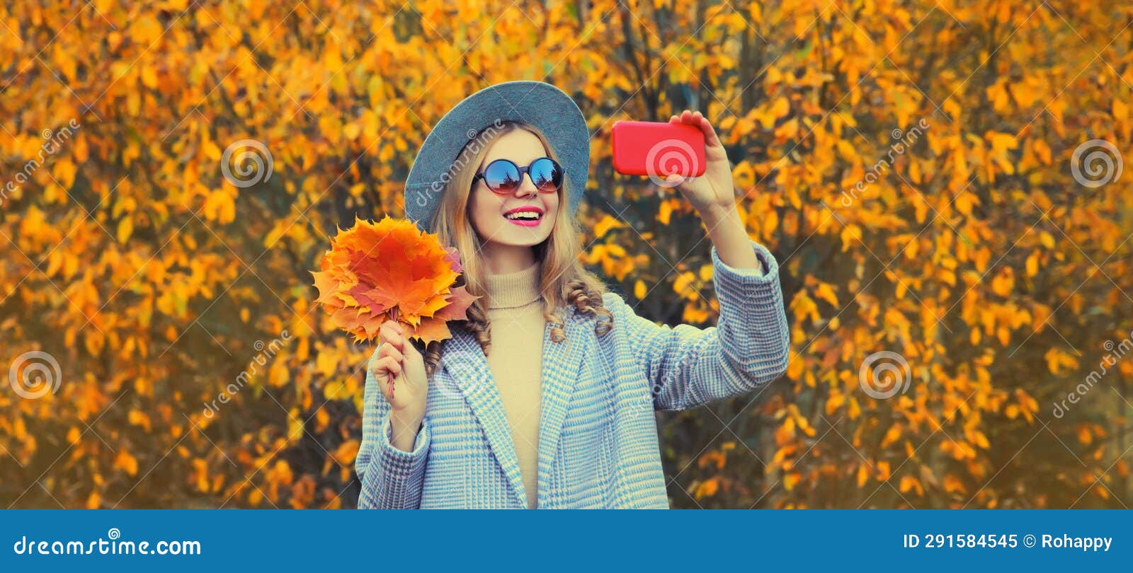 Autumn Portrait Of Stylish Happy Smiling Young Woman Taking Selfie With