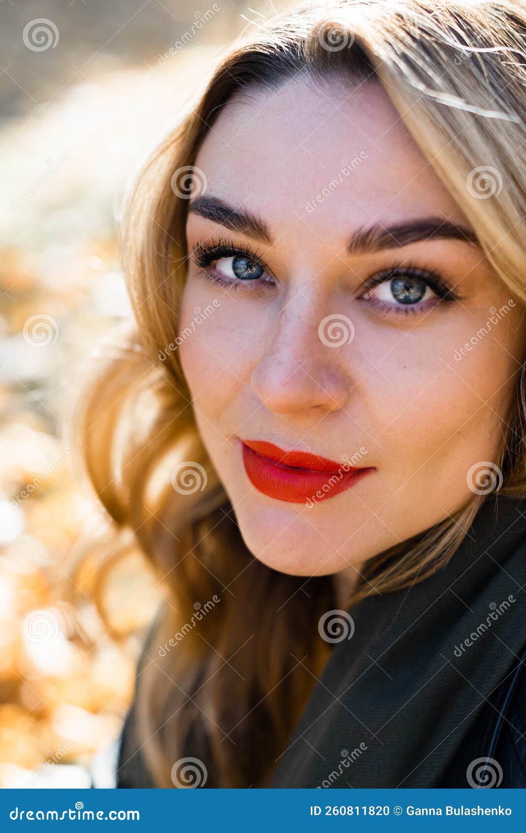 Autumn Portrait of a Young Girl with Blue Eyes, Blond Hair and Red Lips ... Autumn Portrait of a Young Girl with Blue Eyes, Blond Hair and Red Lips ...