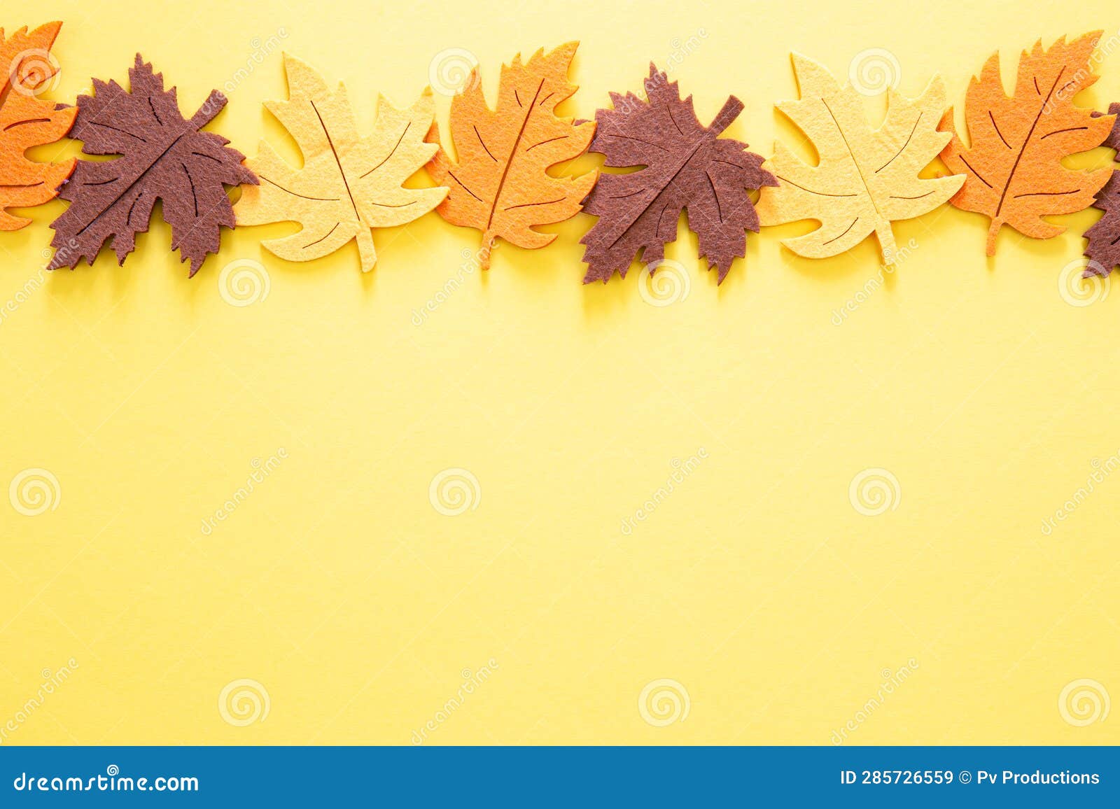 Autumn Yellow Background with Colored Felt Leaves. Stock Image - Image ...