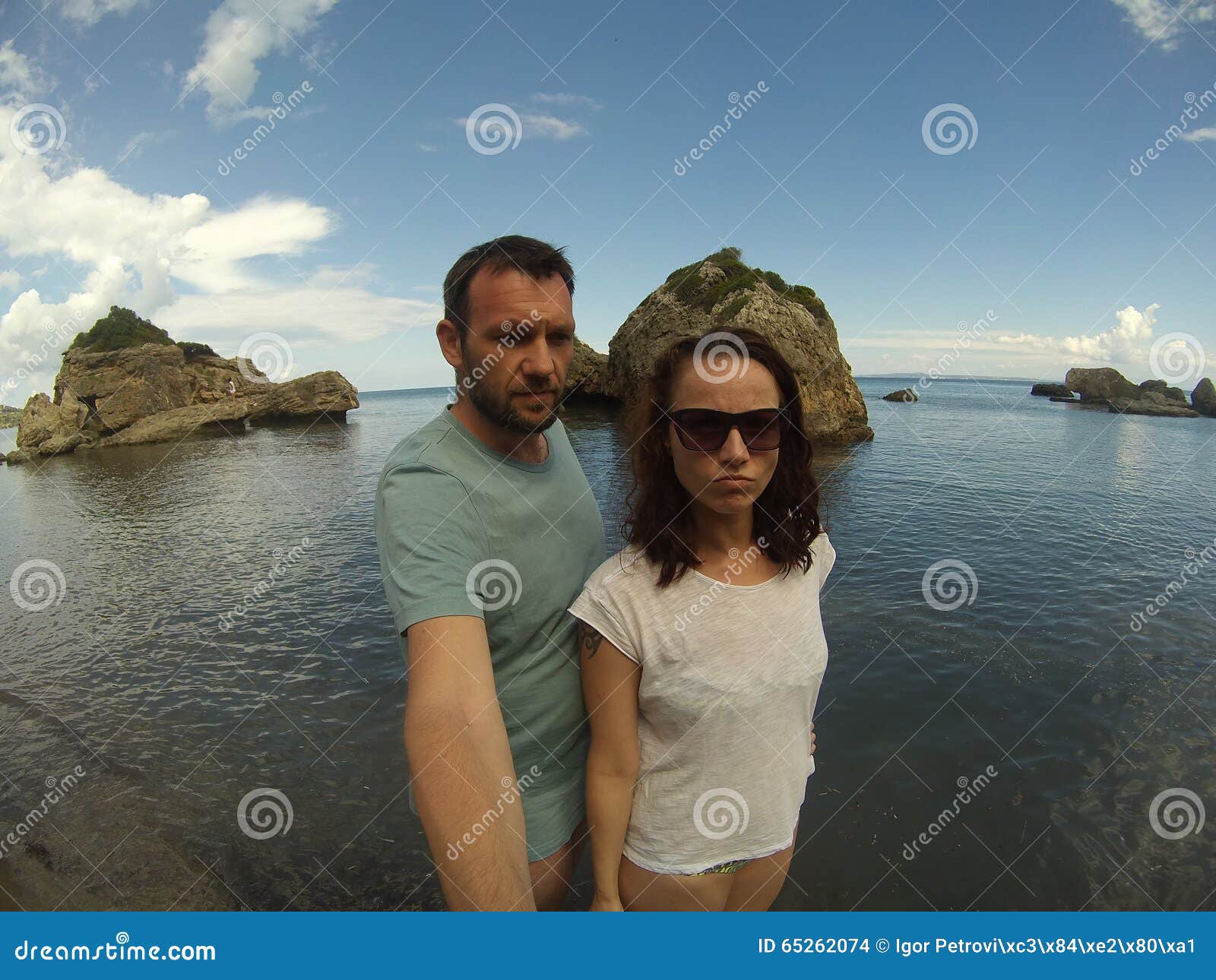 Average Looking Couple on the Rocky Beach Stock Photo - Image of selfie ...