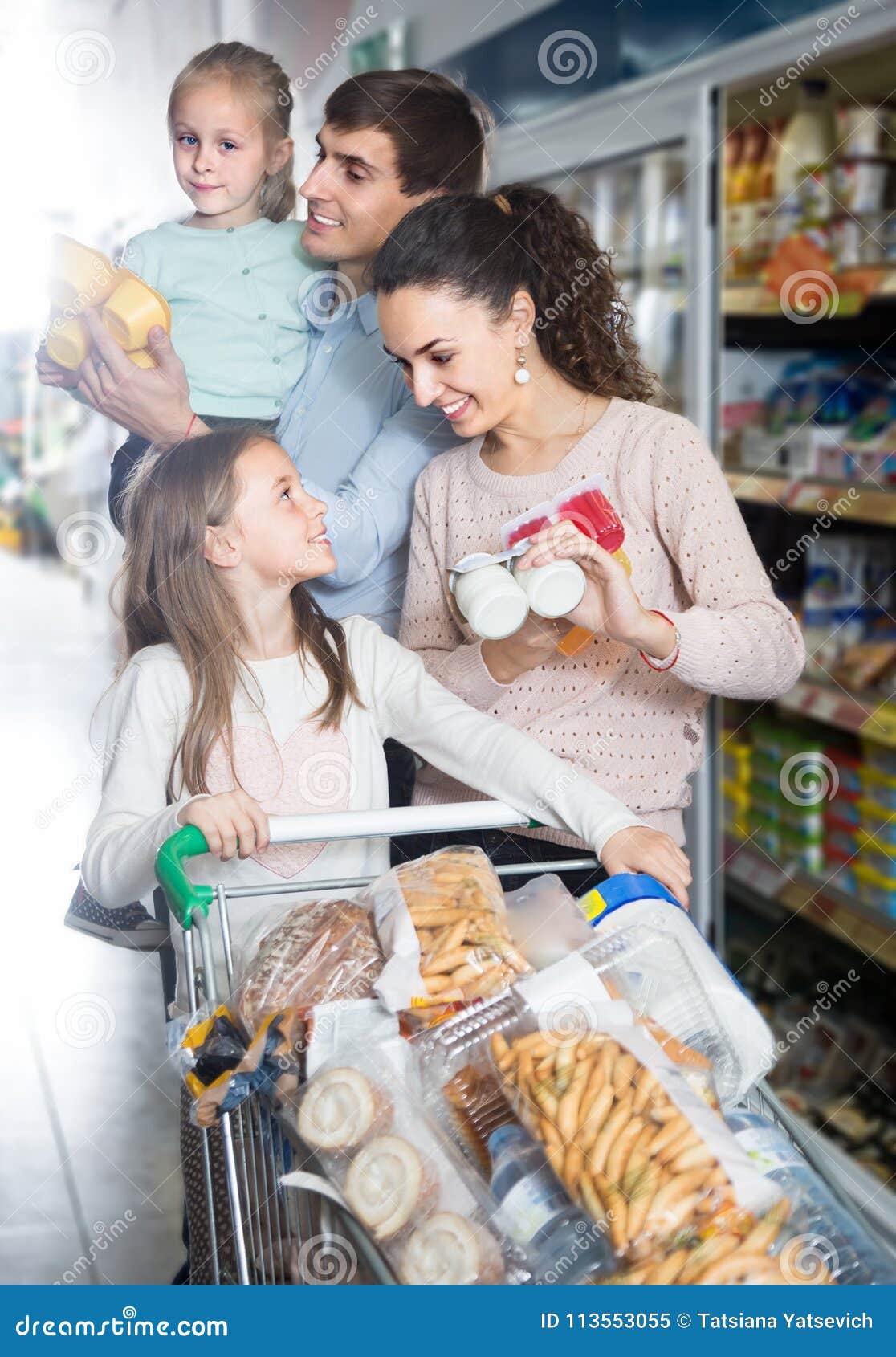 Parents with Two Little Kids Holding Purchases in Store Stock Image ...