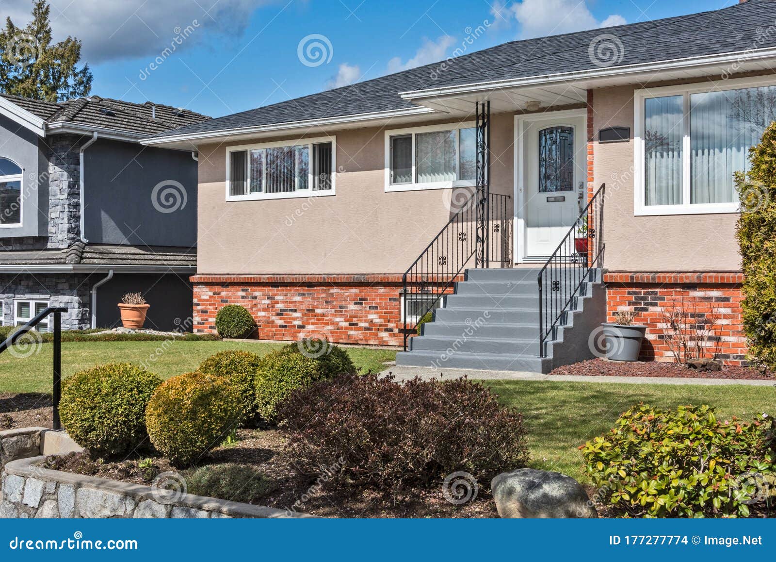 Average Single Family House with Front Yard on Land Terrace Stock Photo ...