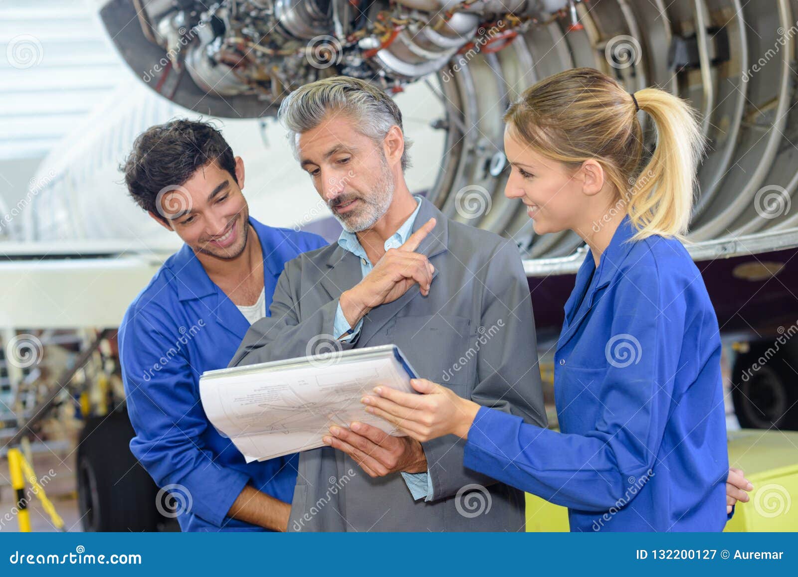 Aviation Students Looking at Folder with Teacher Stock Image - Image of ...